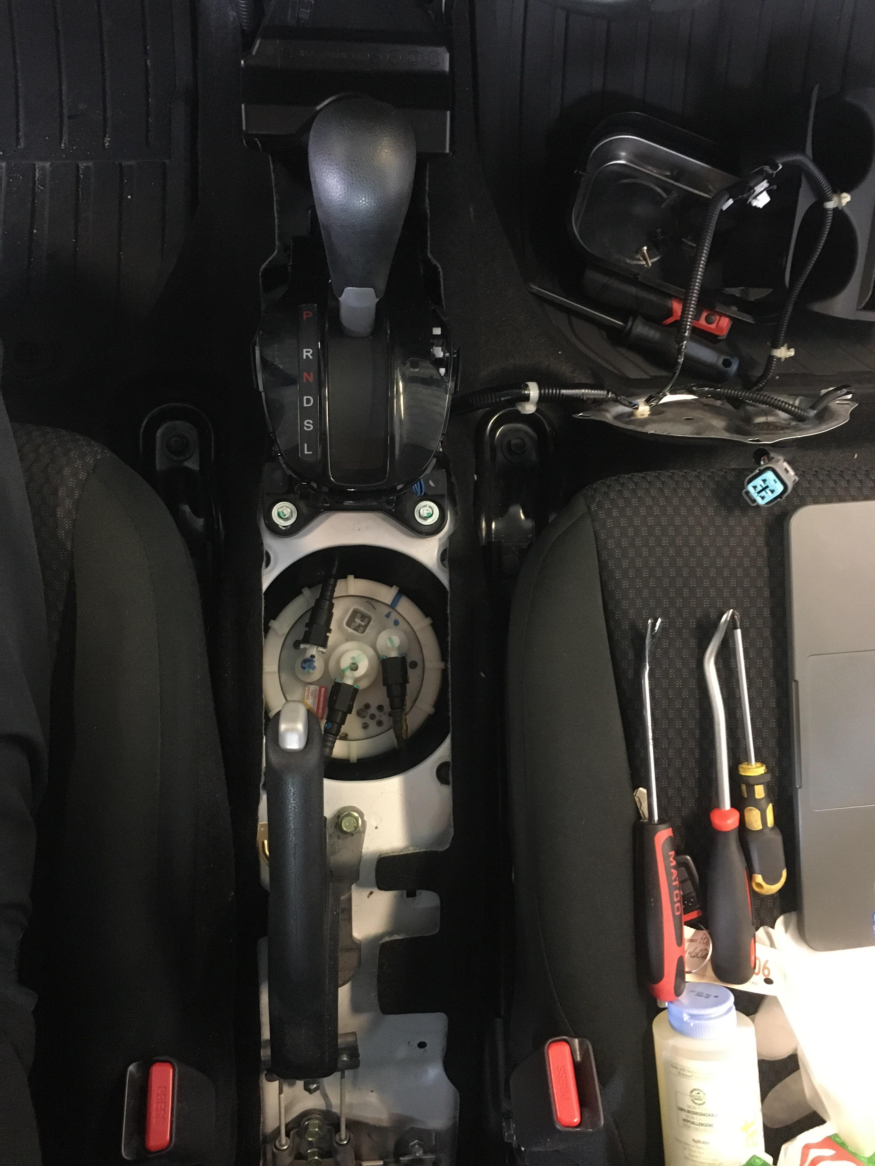 2019 Honda Fit fuel pump located underneath the center console. | Scrolller