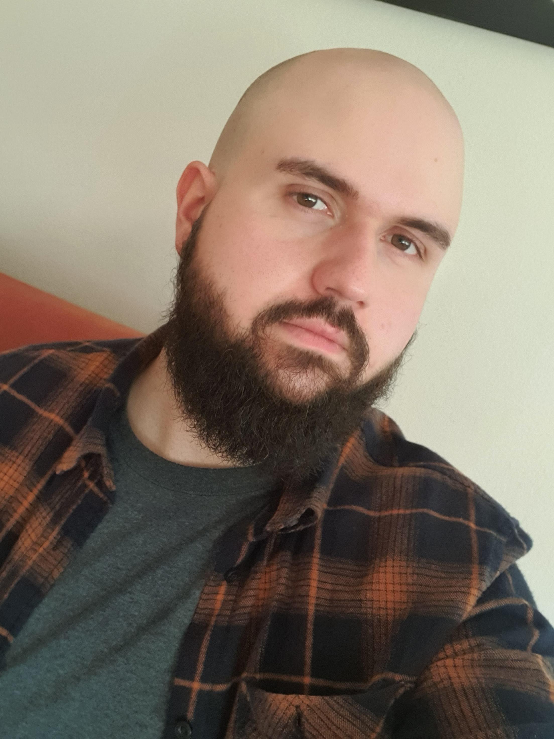 (22M) First bald selfie I'm kinda okay with. The beard is a bit messy and I need to learn to ...