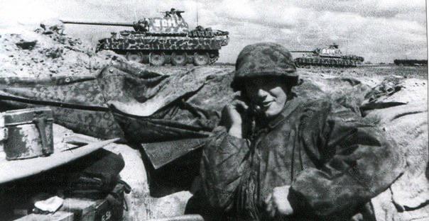 A Panzergrenadier from the 5th SS Division “Wiking” talking on a field phone during the battle ...