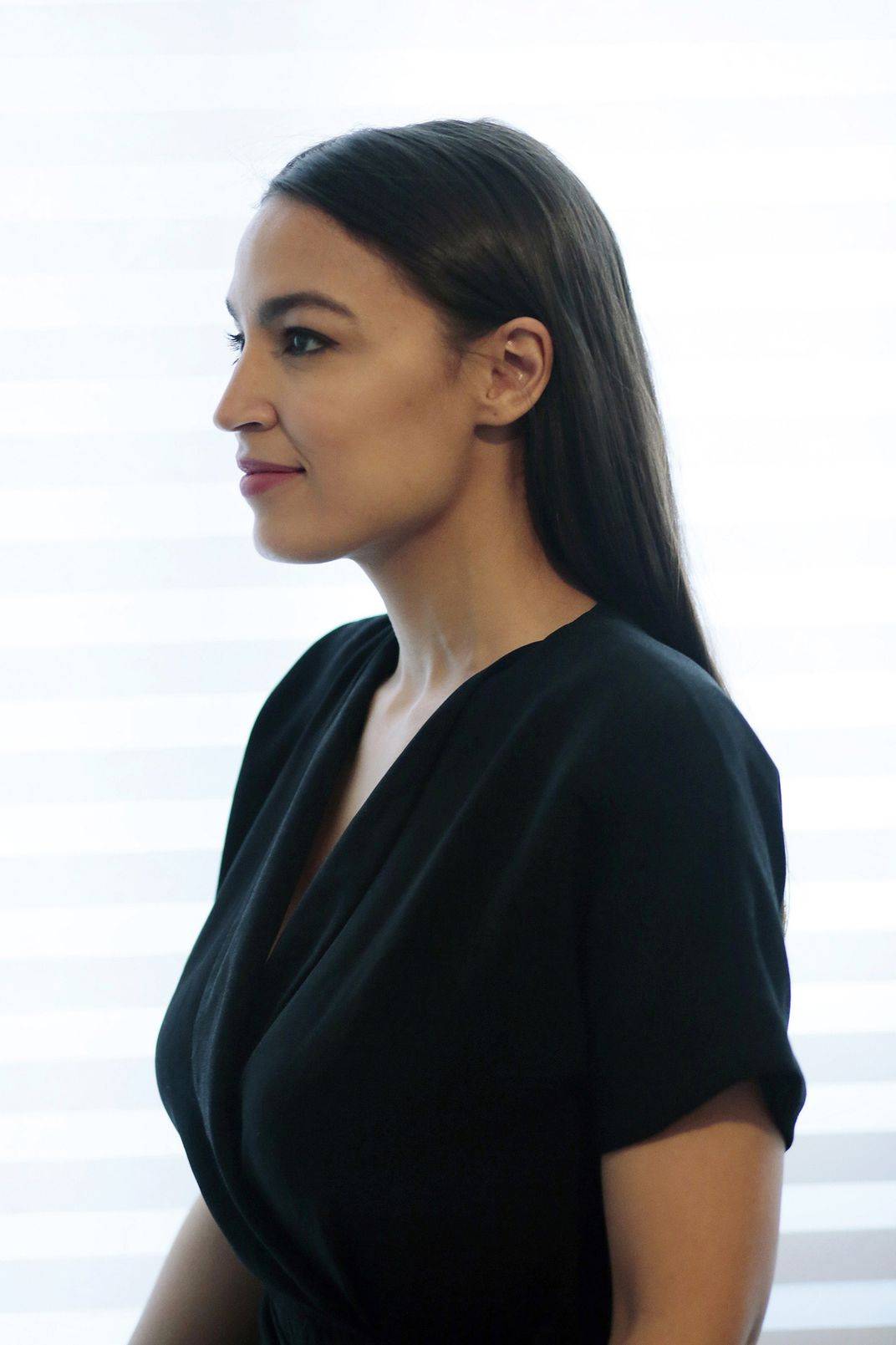 A translucent AOC in profile showing her long, beautiful dark hair and heavy breasts. | Scrolller