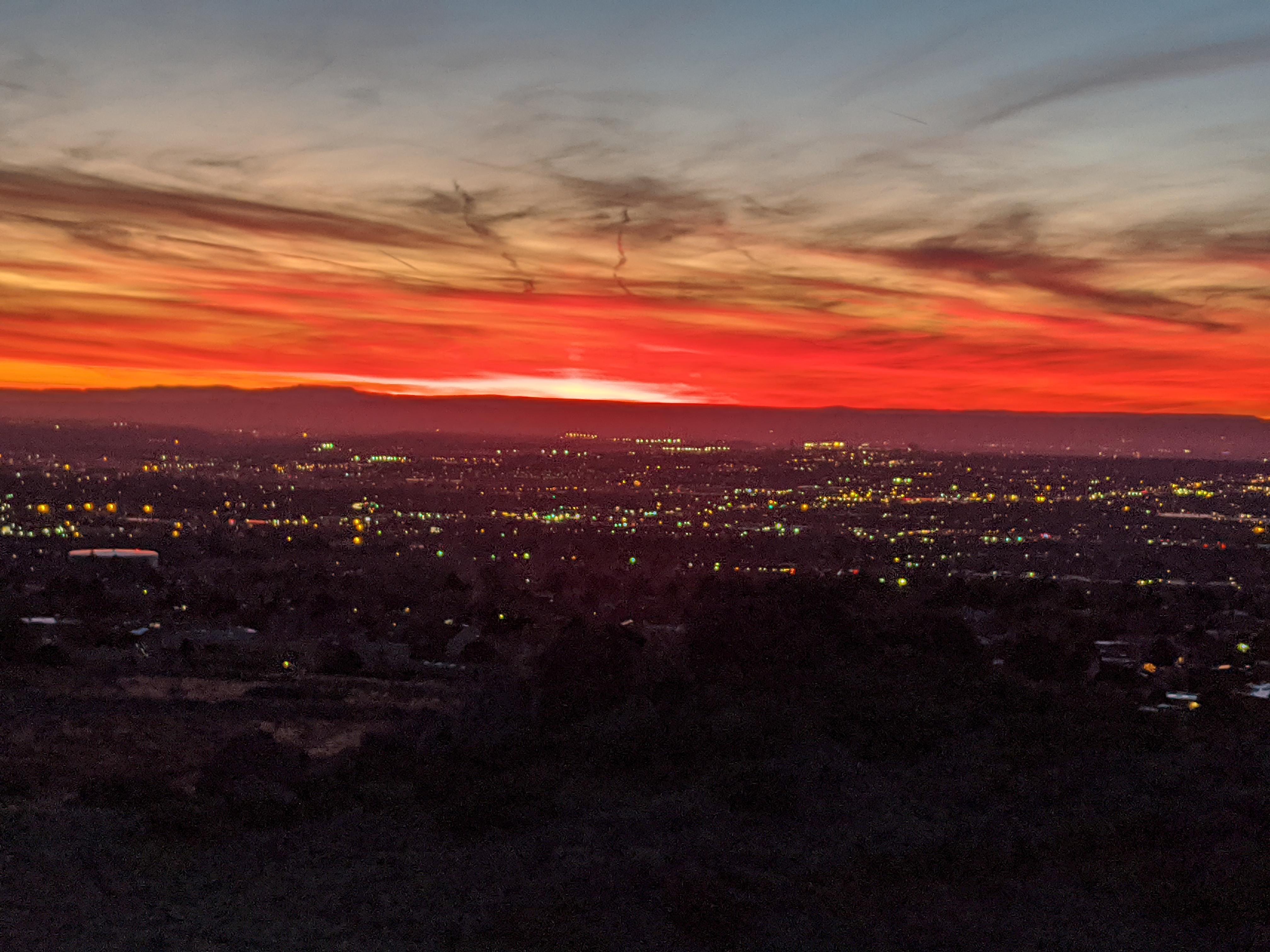 Albuquerque sunset as seen from the Sandia mountains. | Scrolller