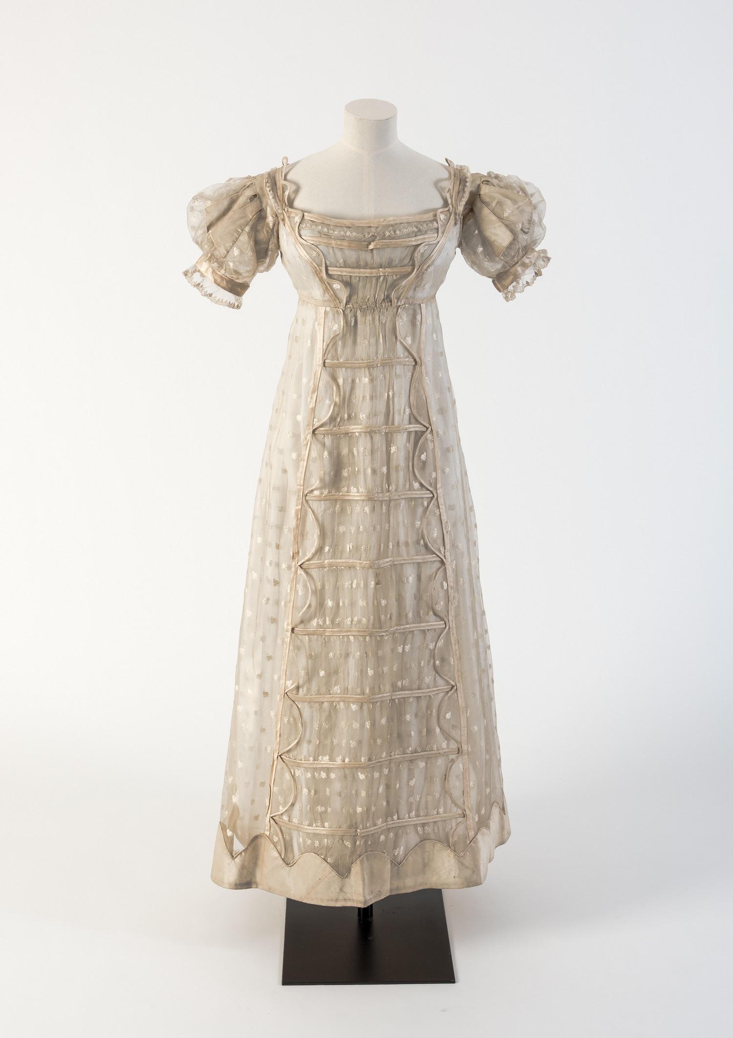 An 1817 silk gauze Madras lace dress with silk satin trim. | Scrolller