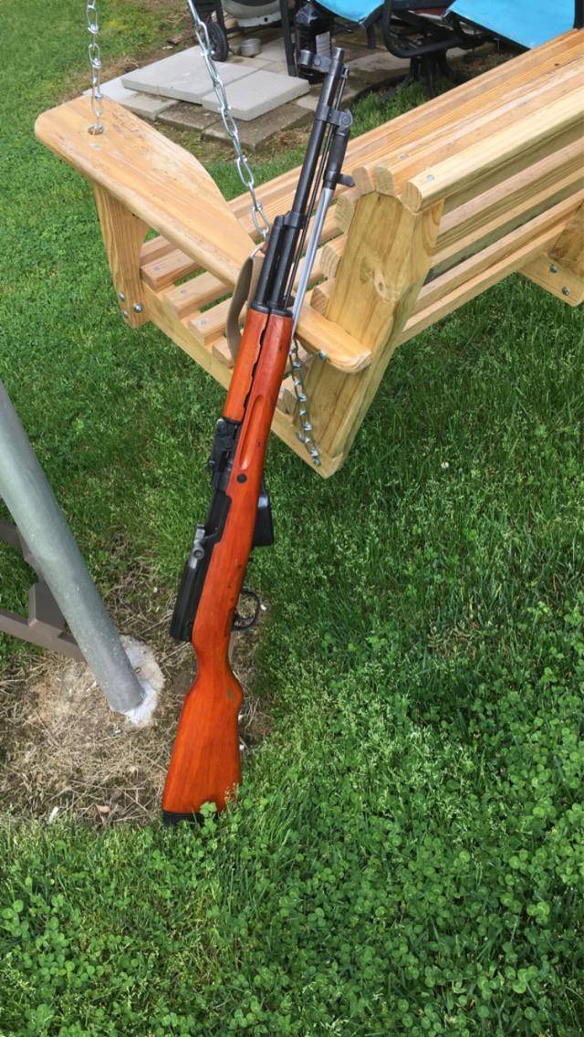 An SKS in its natural habitat, the front yard | Scrolller