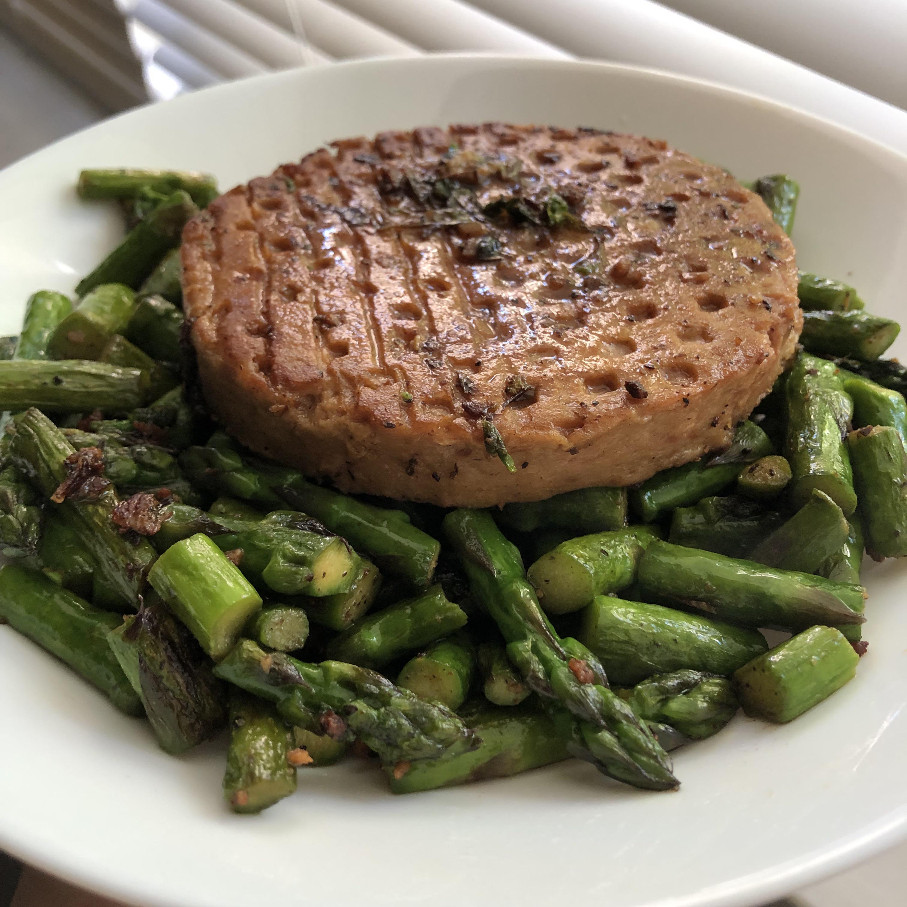 Asparagus and a veggie burger. | Scrolller