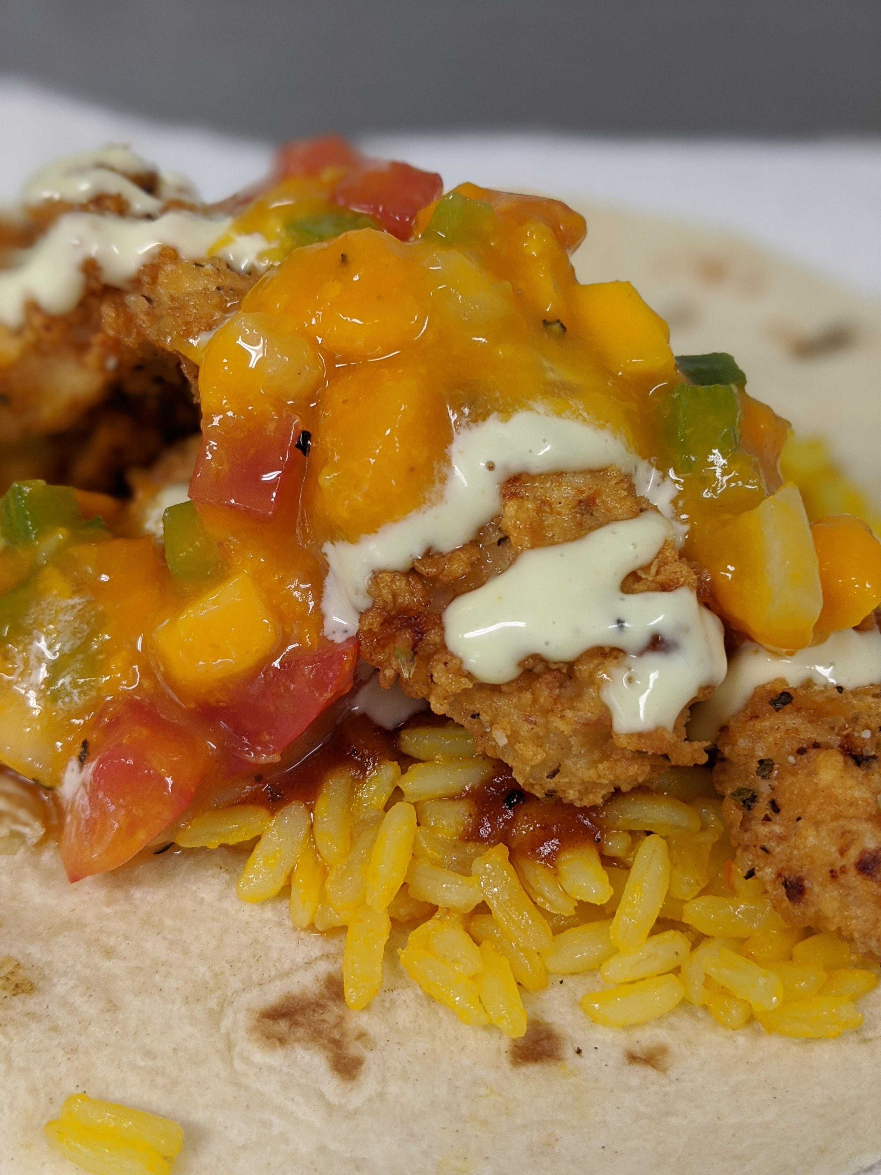 Bangin' Fried Chicken tacos. saffron rice, mango salsa, white bbq sauce. Didn't make the ...
