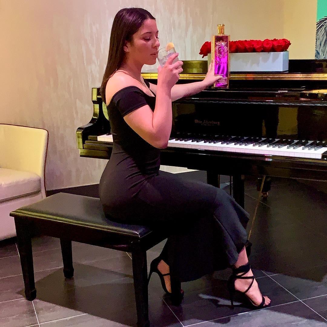 Black Dress on the Piano | Scrolller