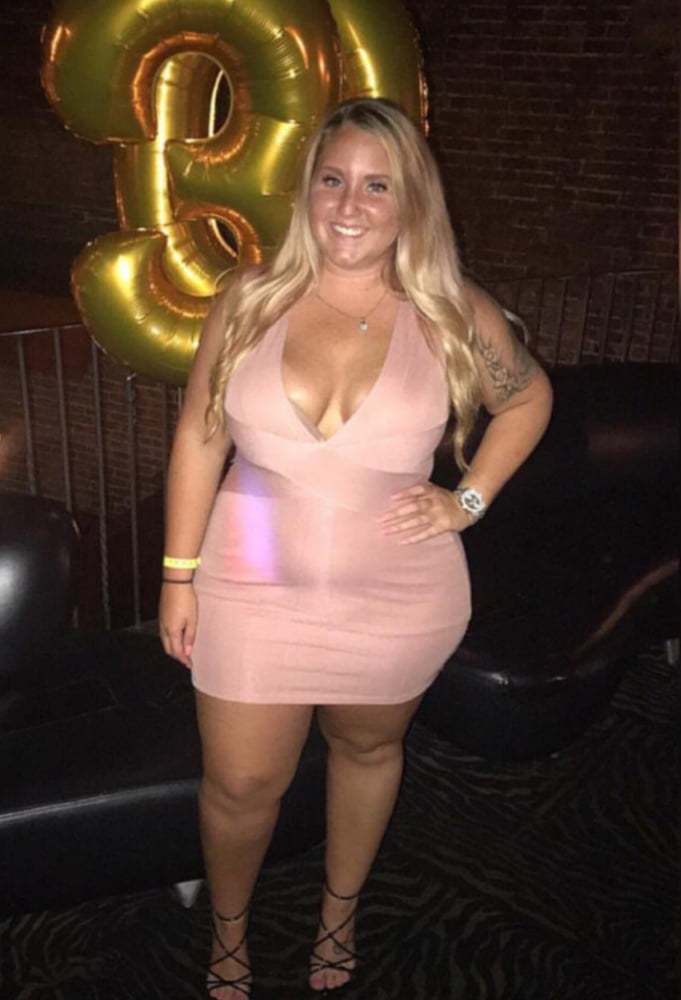 Blonde cutie showcasing her impressive curves in a tight dress | Scrolller