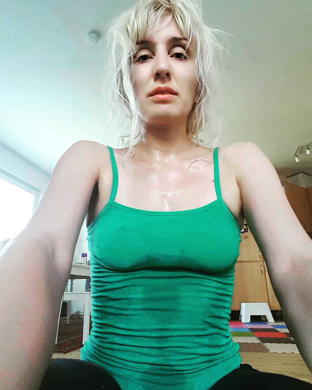 blonde in green tank | Scrolller