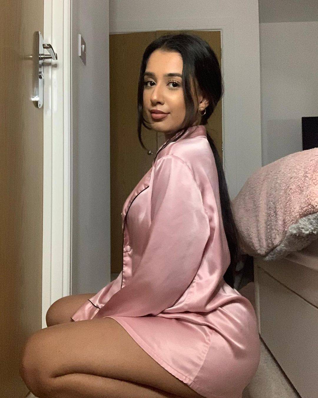 British Indian Beauty in Pink Robe | Scrolller