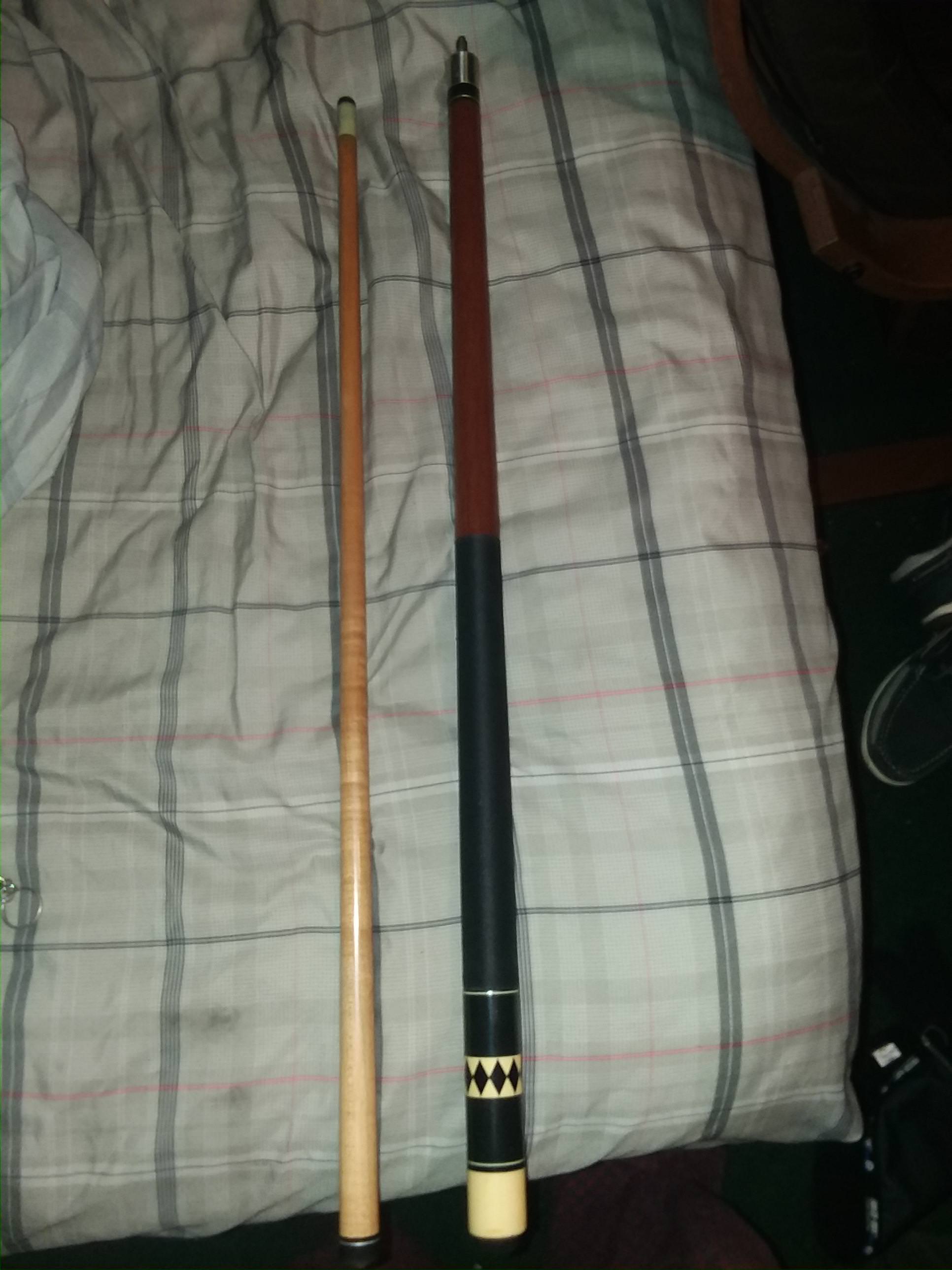 Can anybody tell me what kind of pool cue this is and what it's made of? I believe it's a bit ...