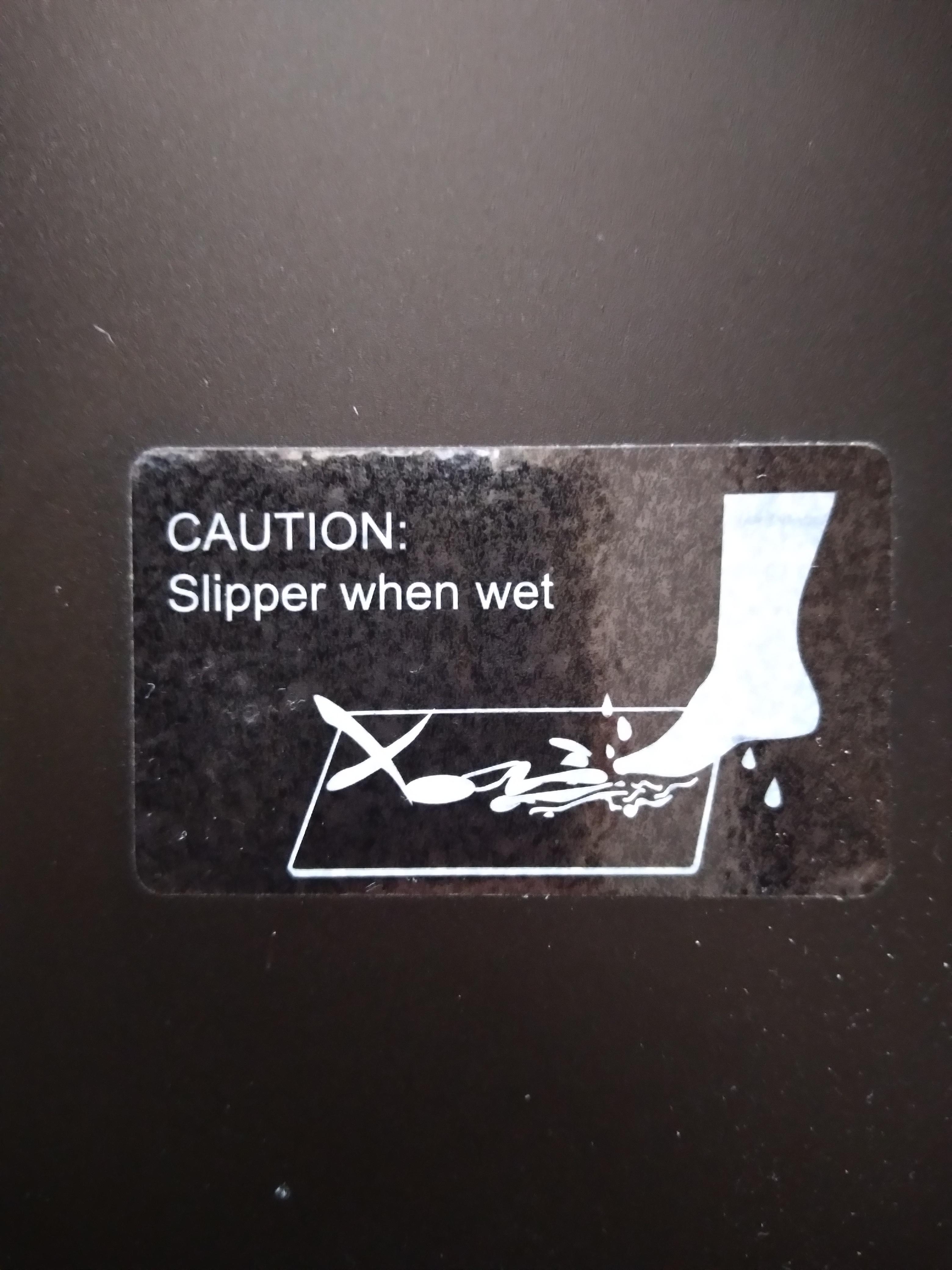 CAUTION: Slipper when wet | Scrolller