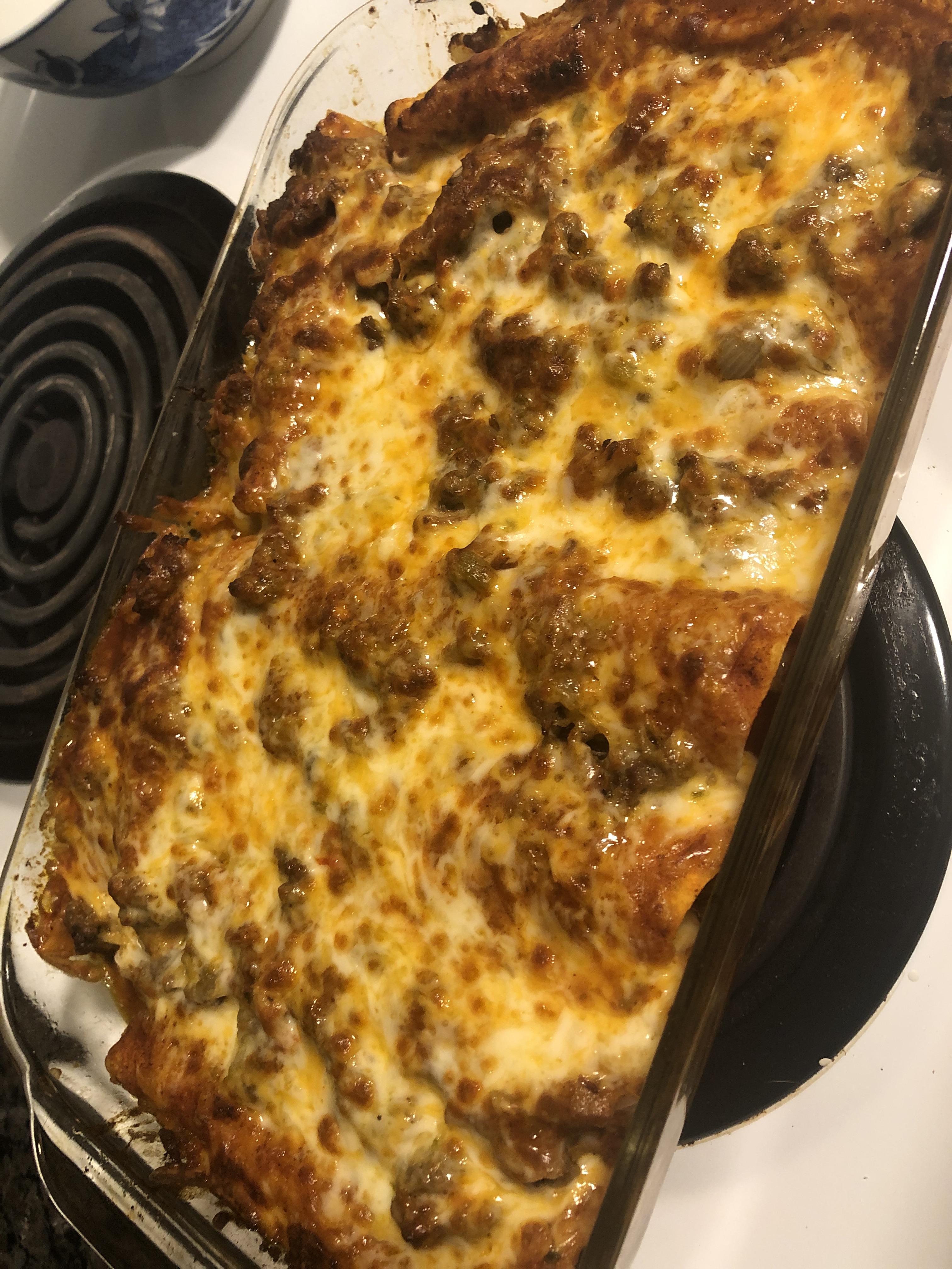 Cheesy carnitas and beef enchiladas. | Scrolller