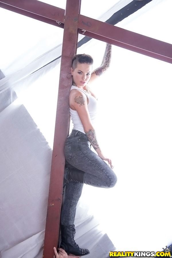 Christy Mack in jeans and a white top | Scrolller