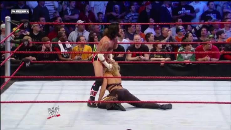 CM Punk carrying an unconscious Beth Phoenix. | Scrolller