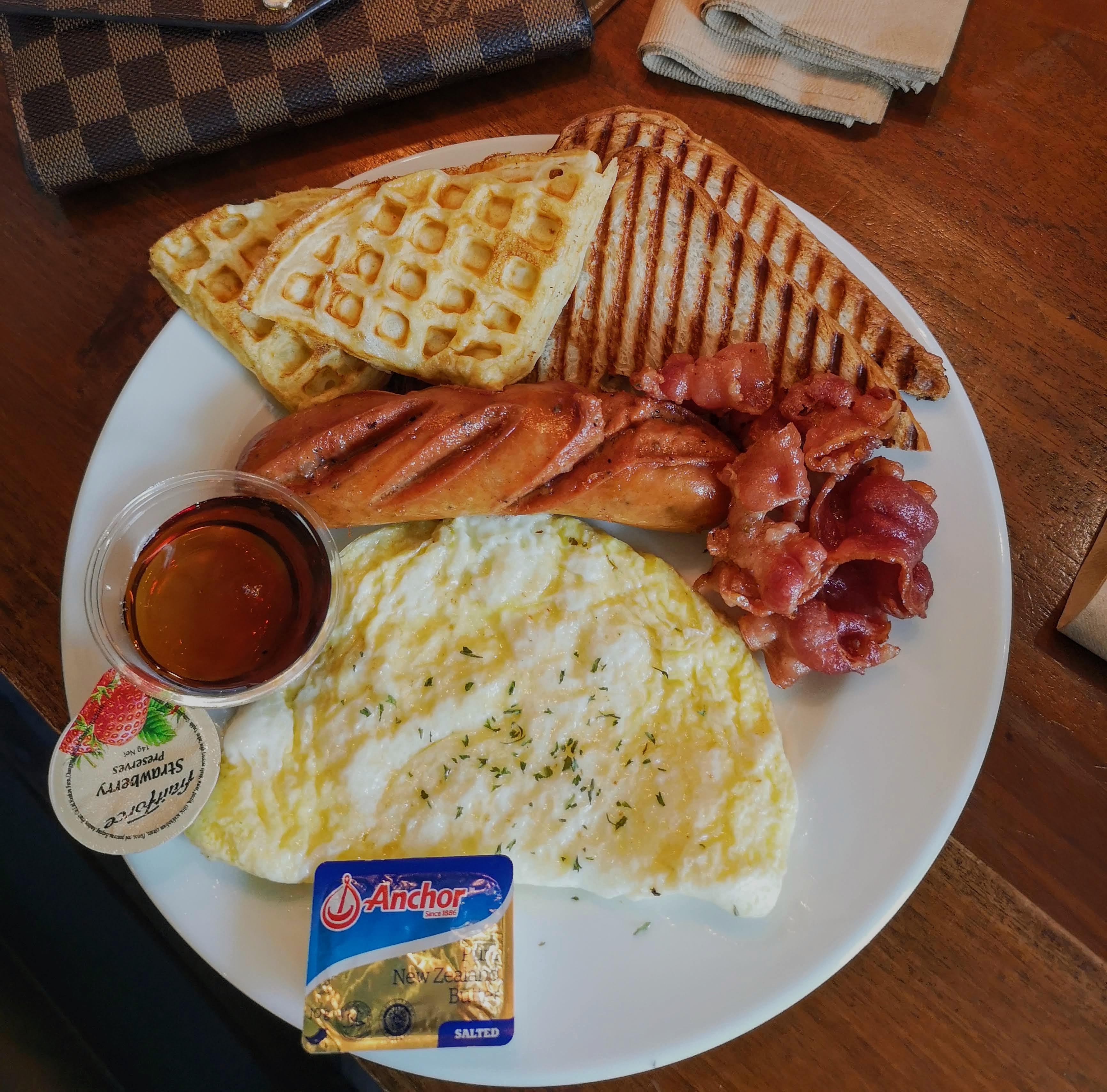 Continental Breakfast (Waffles, Toast, Sausage, Bacon, and Omelette with Syrup, Butter, and ...