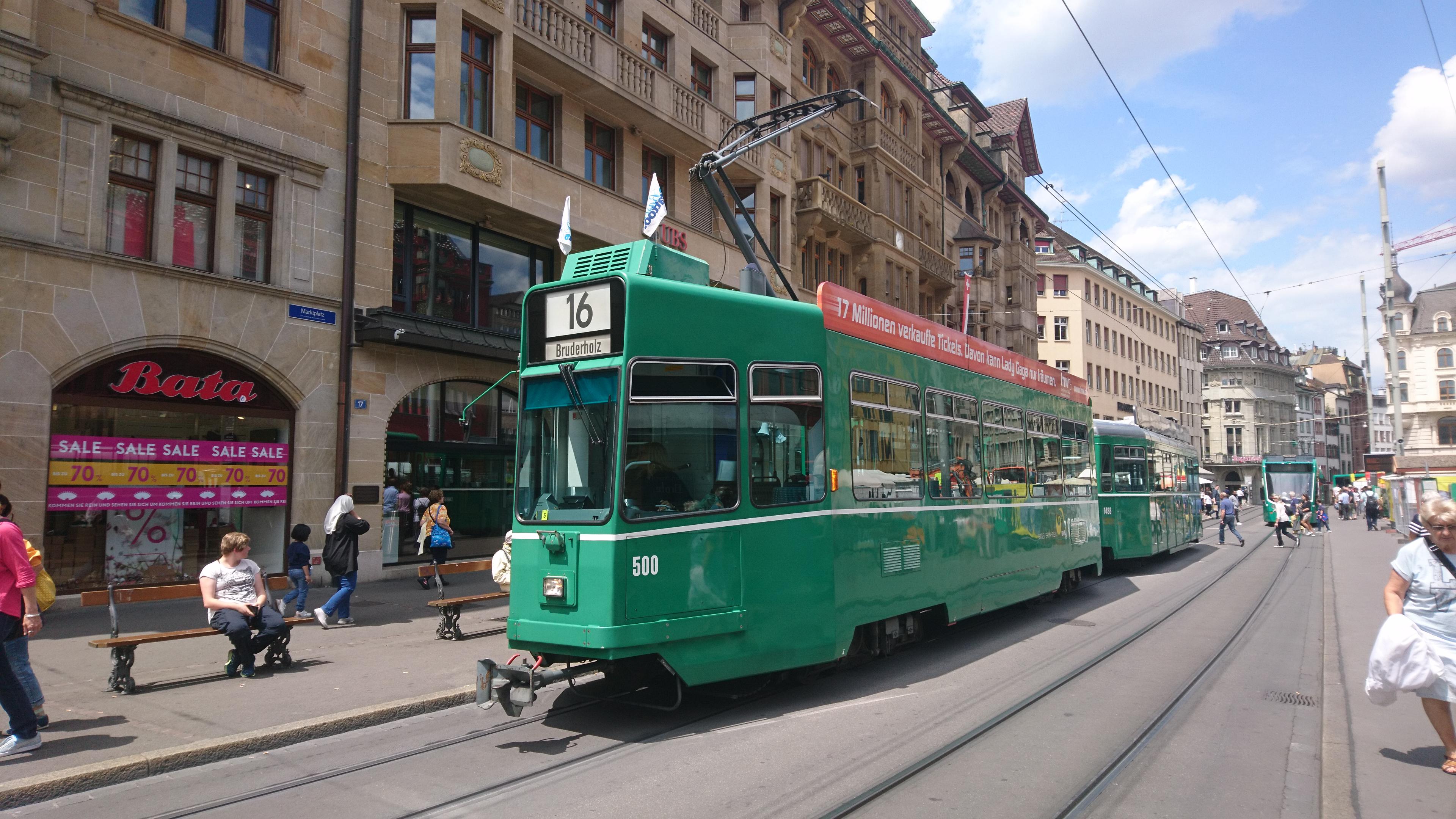 'Cornichon' tram with trailer at Marktplatz in Basel, Switzerland | Scrolller