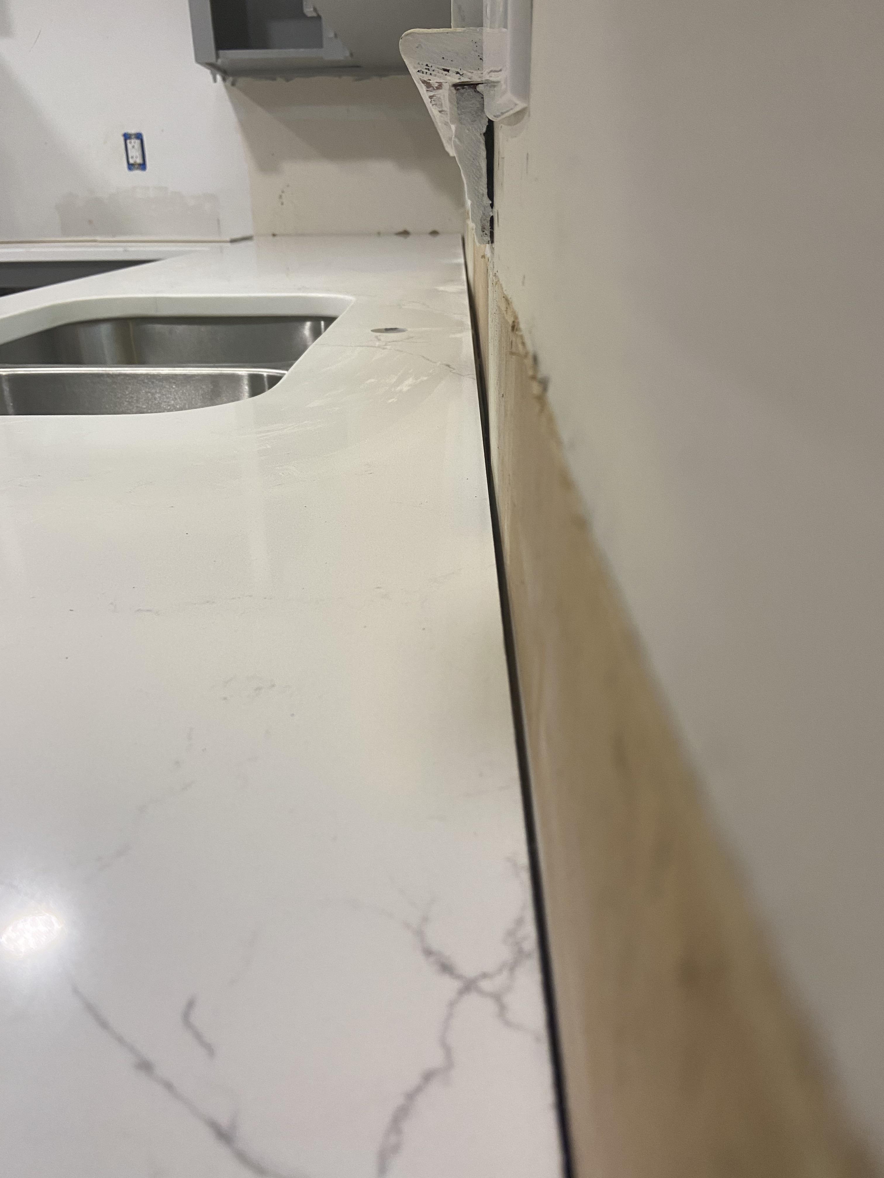 Countertops were installed today, and I had no idea the back wall was so uneven. What’s the best ...