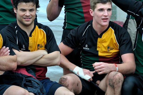 Cute Rugby Player Adjusting His Equipment Scrolller