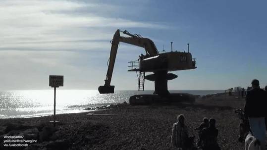 Elevated excavator at a wind farm construction site [1000x562] | Scrolller