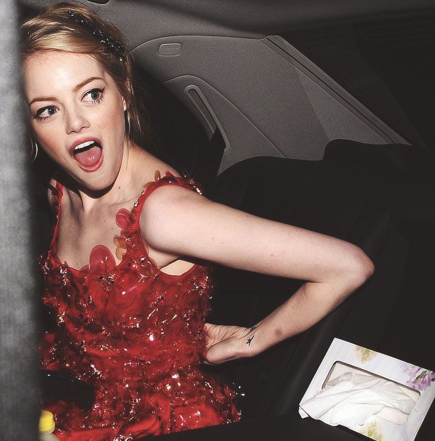 Emma adjusting her dress | Scrolller