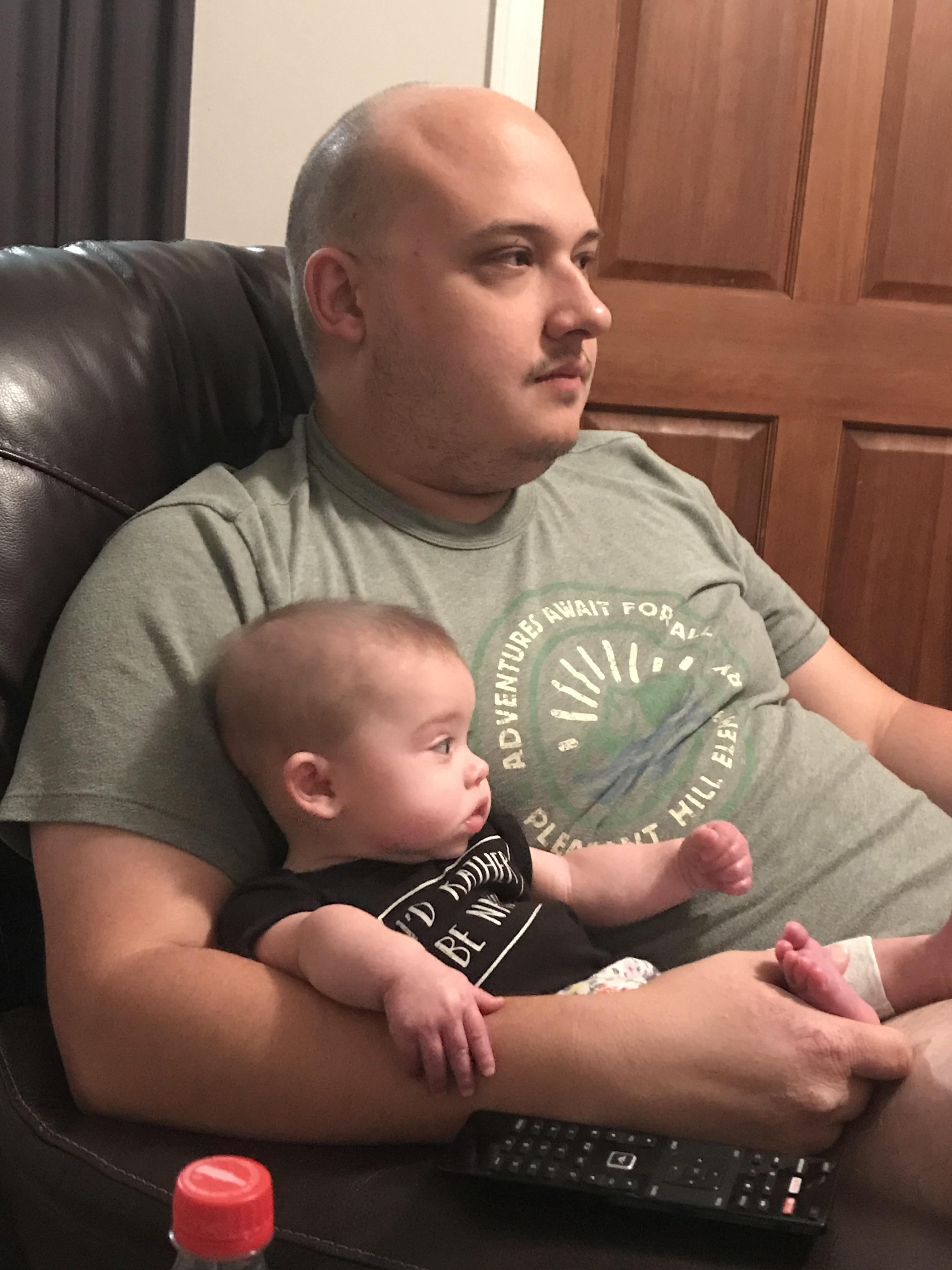 Enjoying some TV time with her daddy | Scrolller