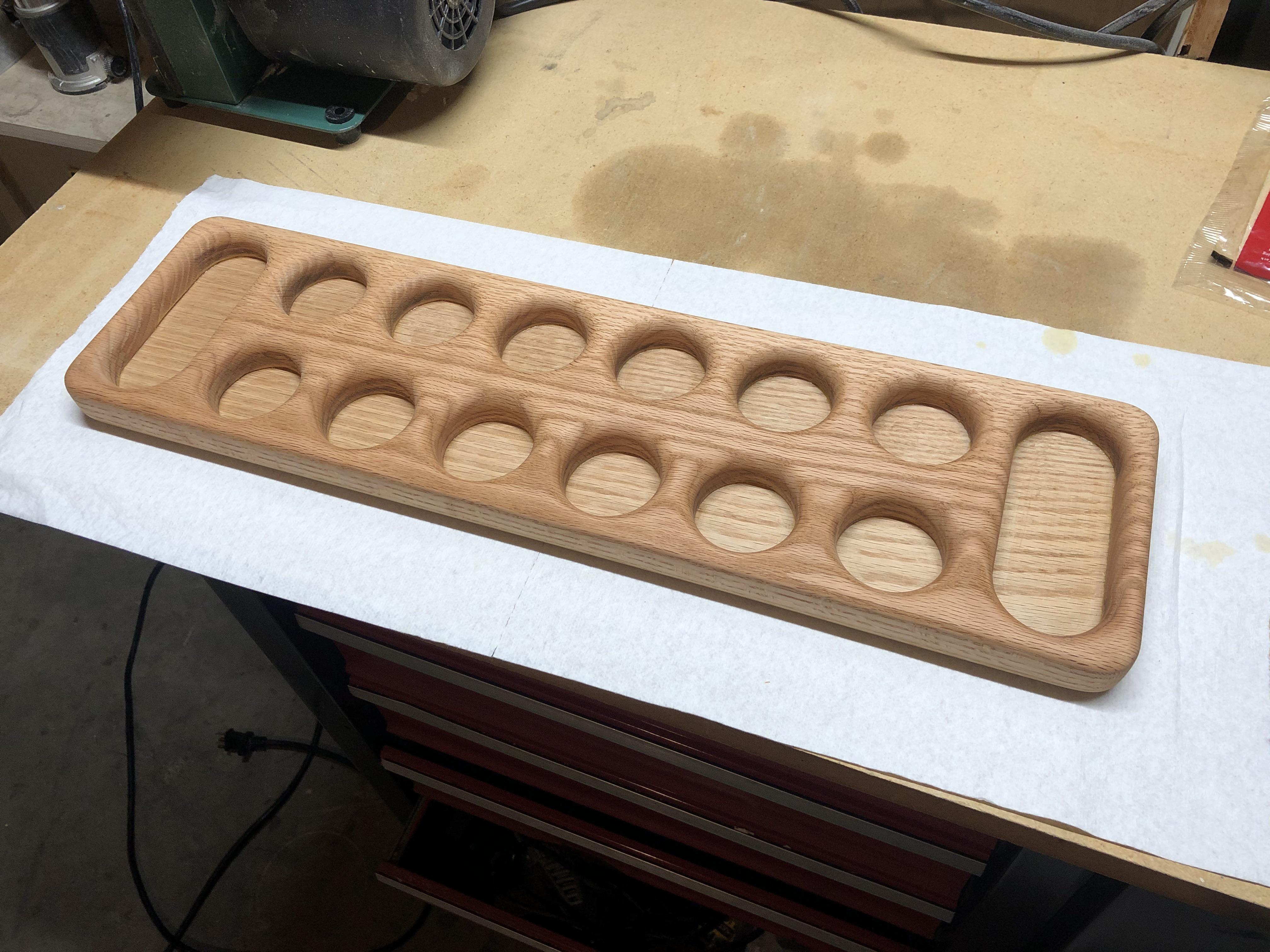 First mancala/oware board. Red oak finished with tung oil | Scrolller