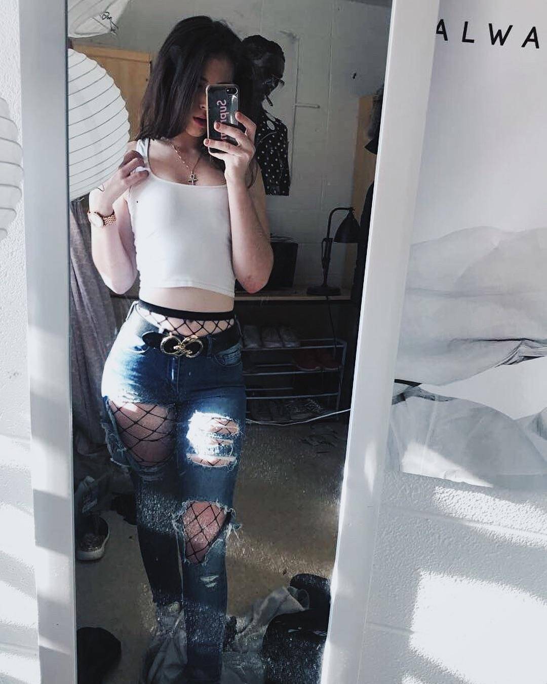 Fishnets under ripped jeans | Scrolller