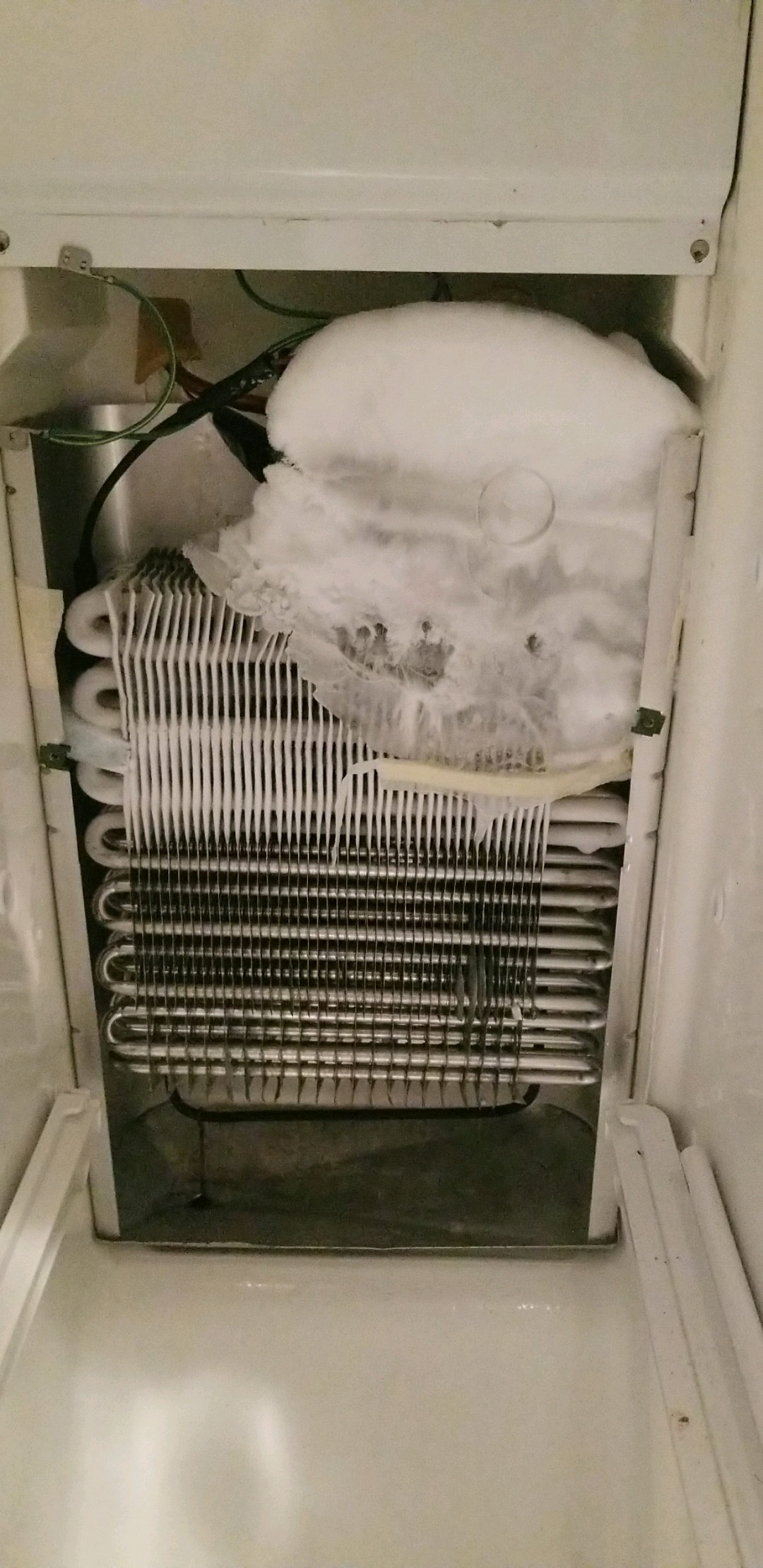 Freezer cooler freezing over. Leaking water onto floor. | Scrolller
