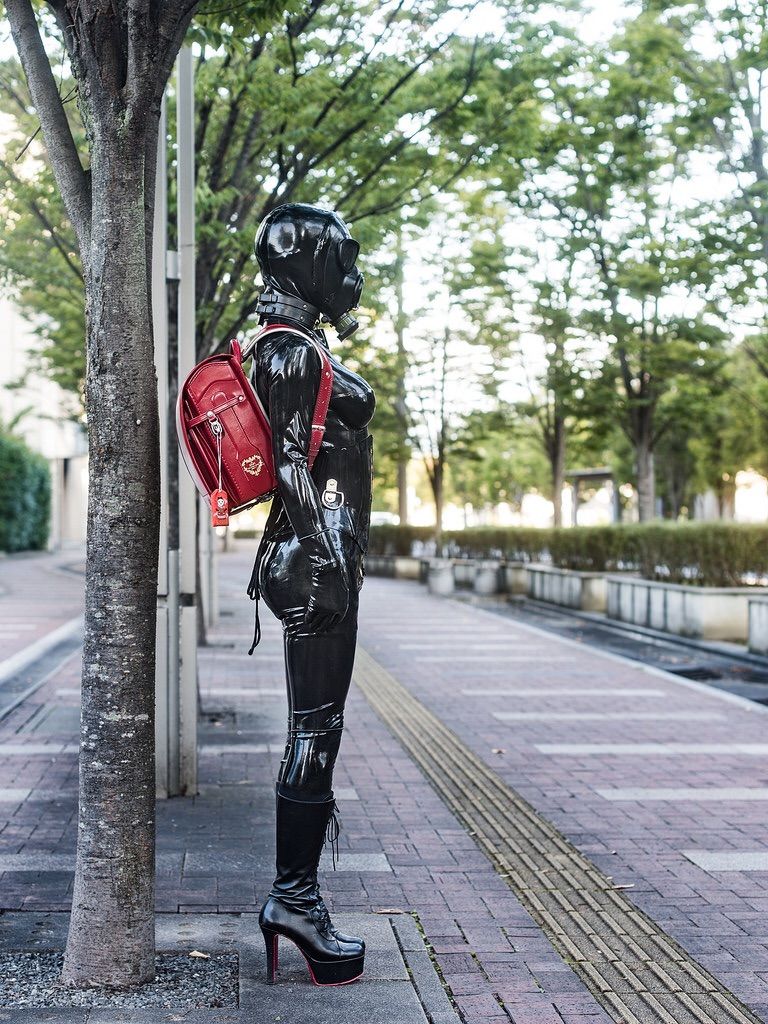 Full latex enclosure and waiting for the bus! | Scrolller