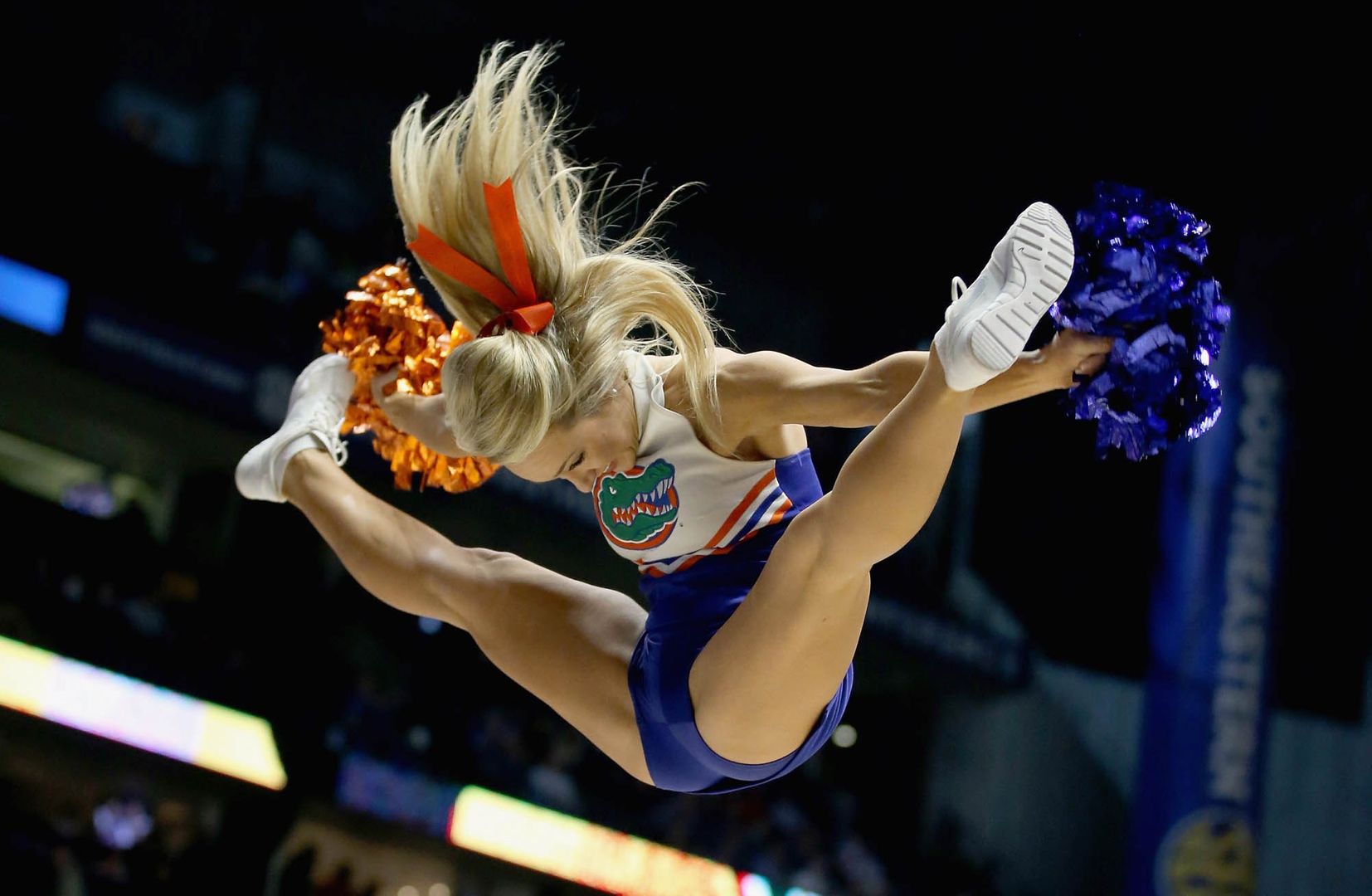 Gator cheerleader spread in the air | Scrolller