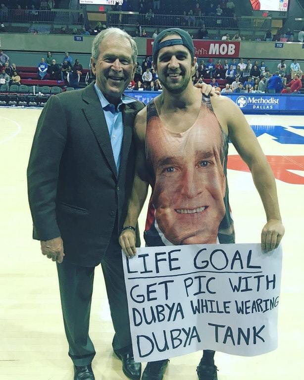 George W. Bush standing next to shirtless supporter. | Scrolller