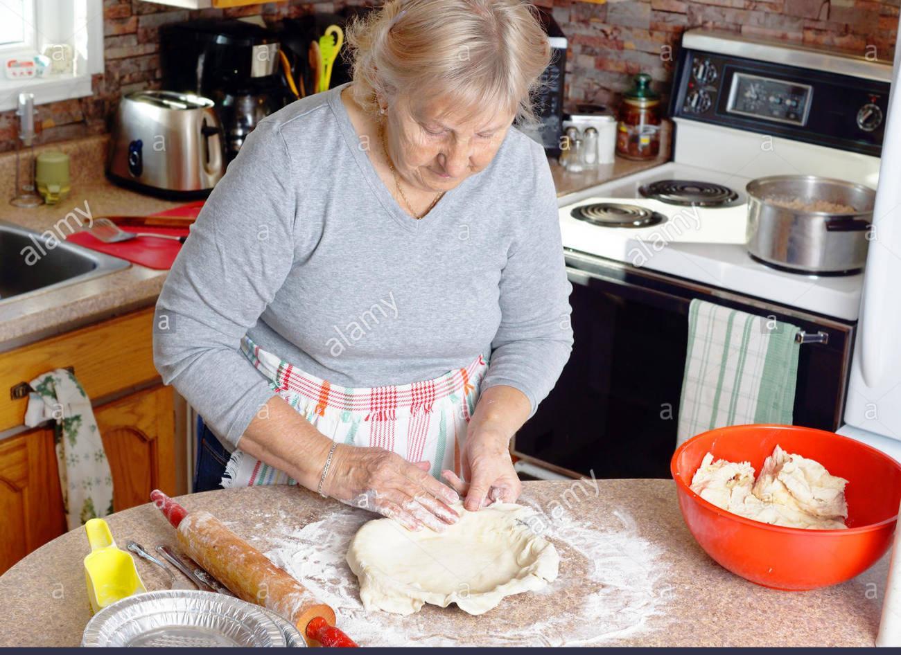 GILF furiously fists her amateur pie crust | Scrolller