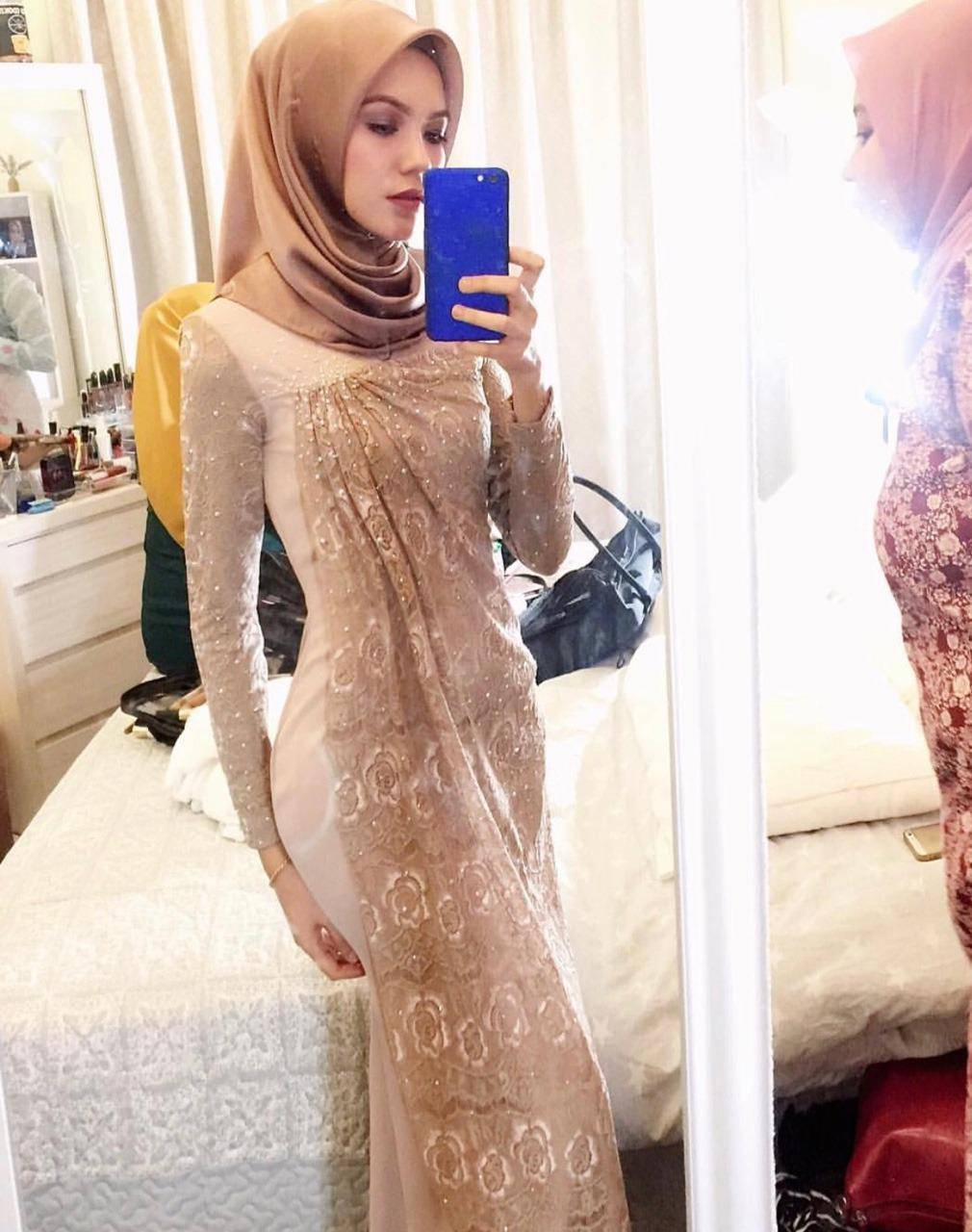 Gosh! This slim and tall hijabi is so hot in that dress! | Scrolller