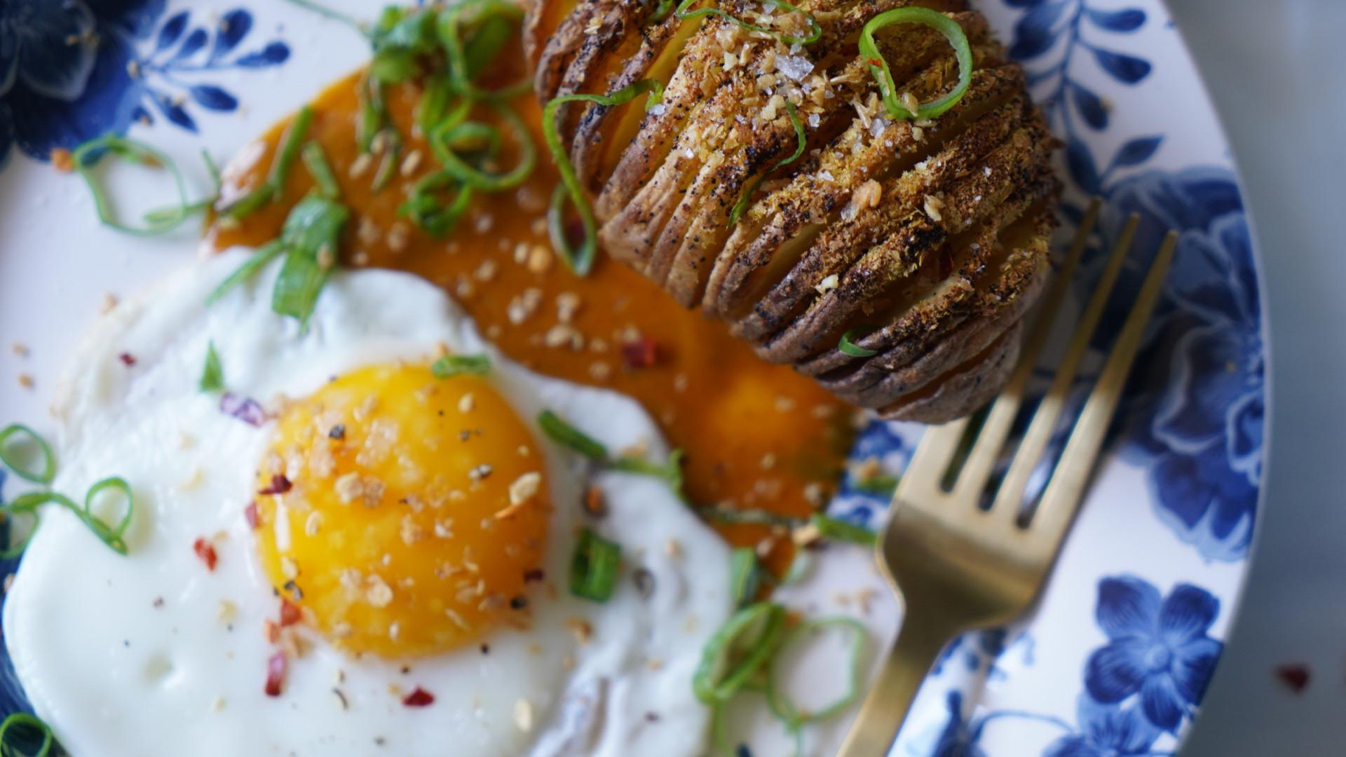 Hasselback potato with egg and Amba sauce | Scrolller