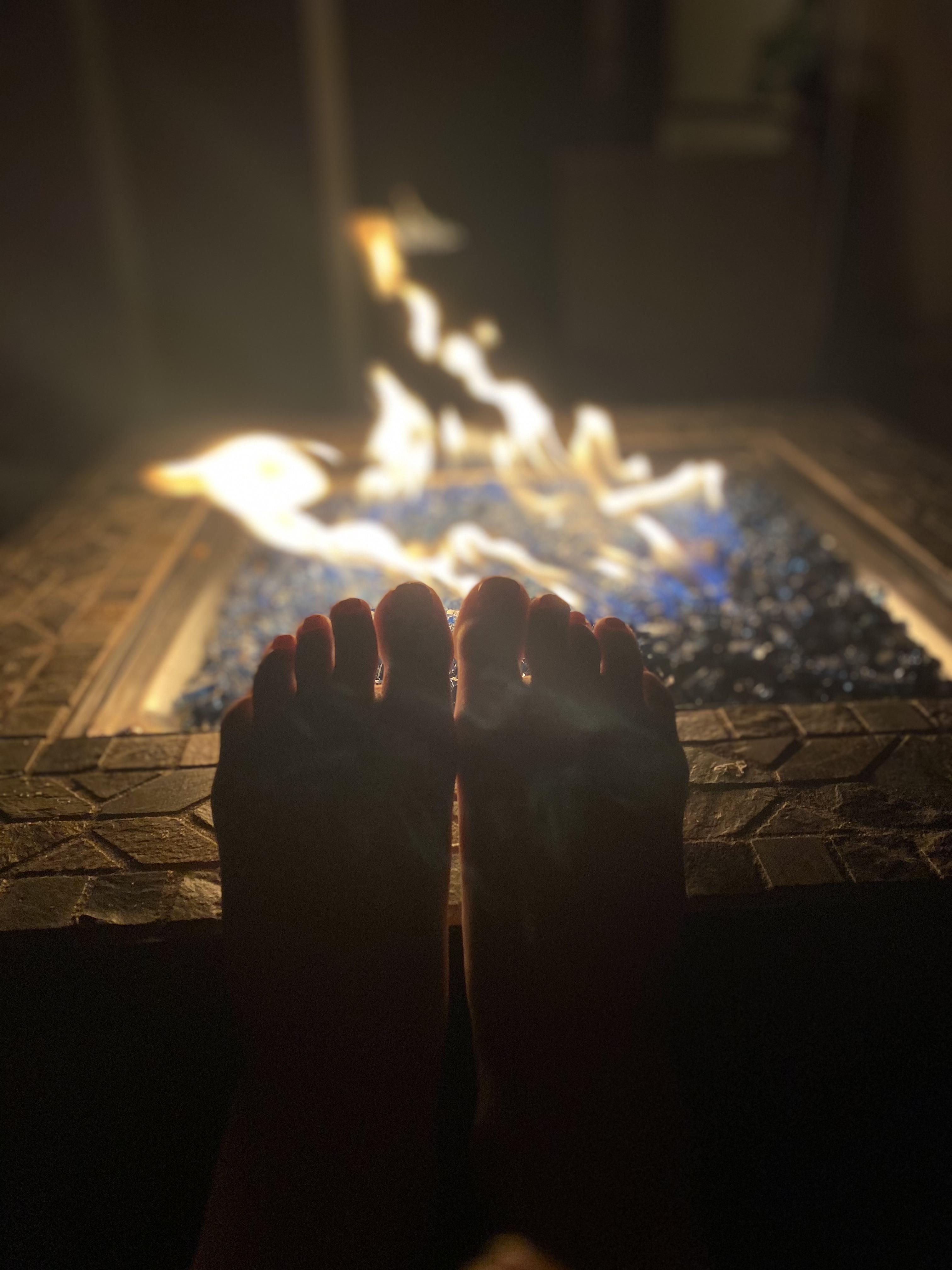 heating up by the fire | Scrolller
