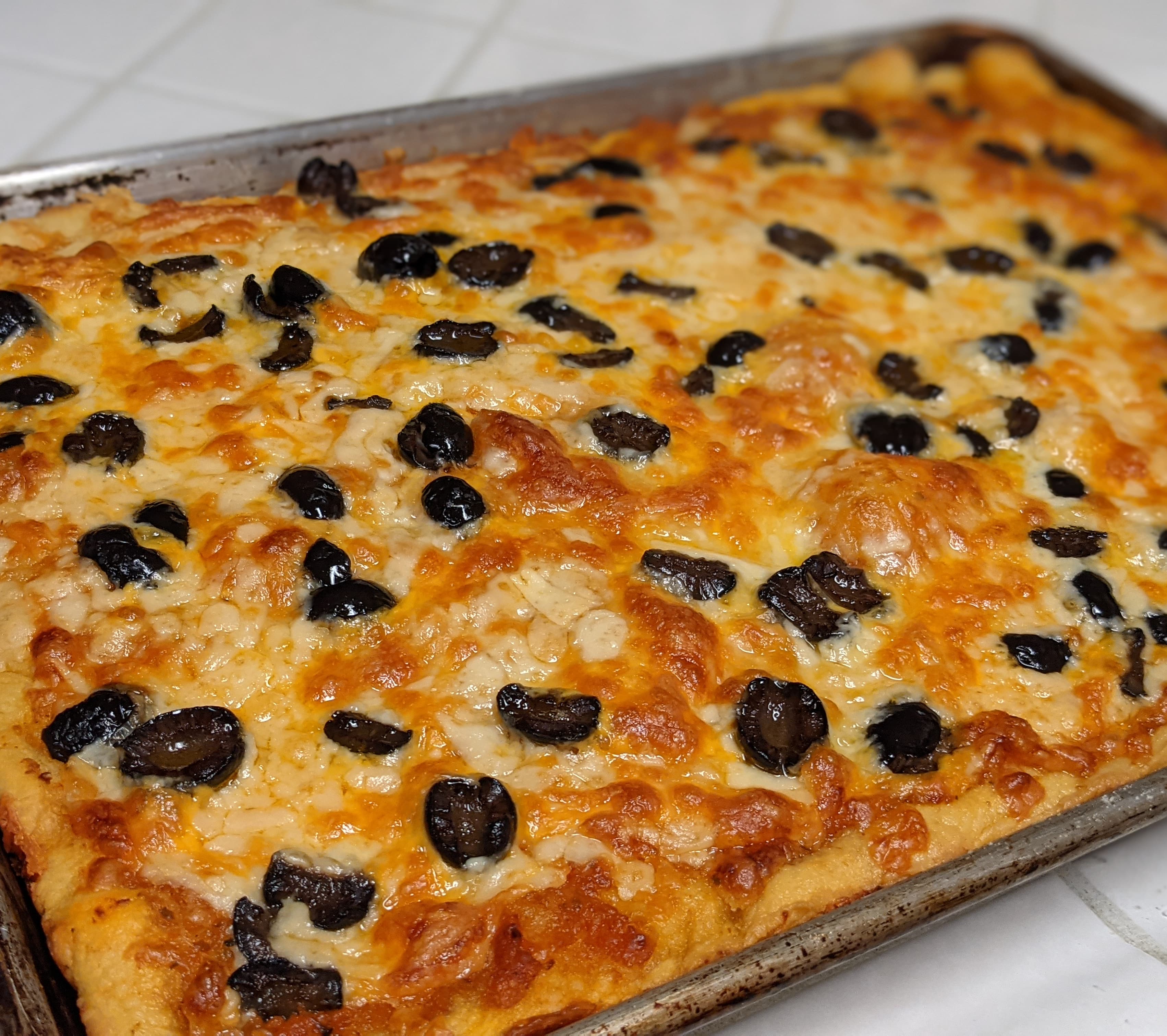 Homemade Cheesy sheet pan pizza w/Olives. | Scrolller