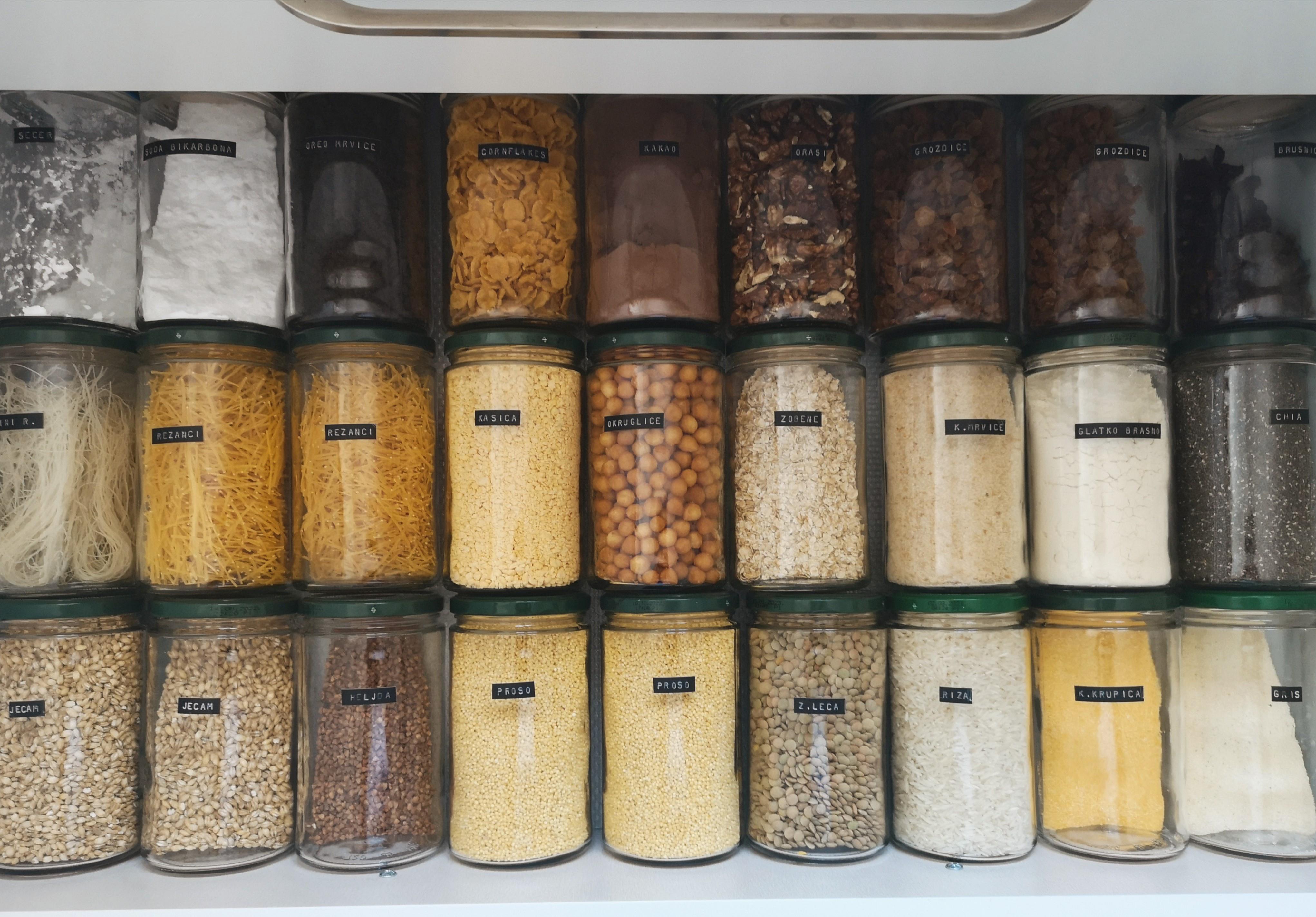 Kitchen drawer filled with recycled jars. | Scrolller