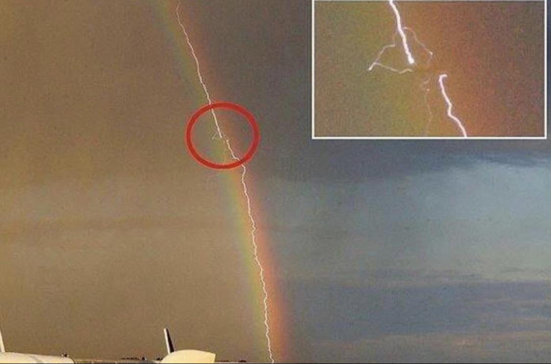 Lightning strikes plane inside of a rainbow... | Scrolller