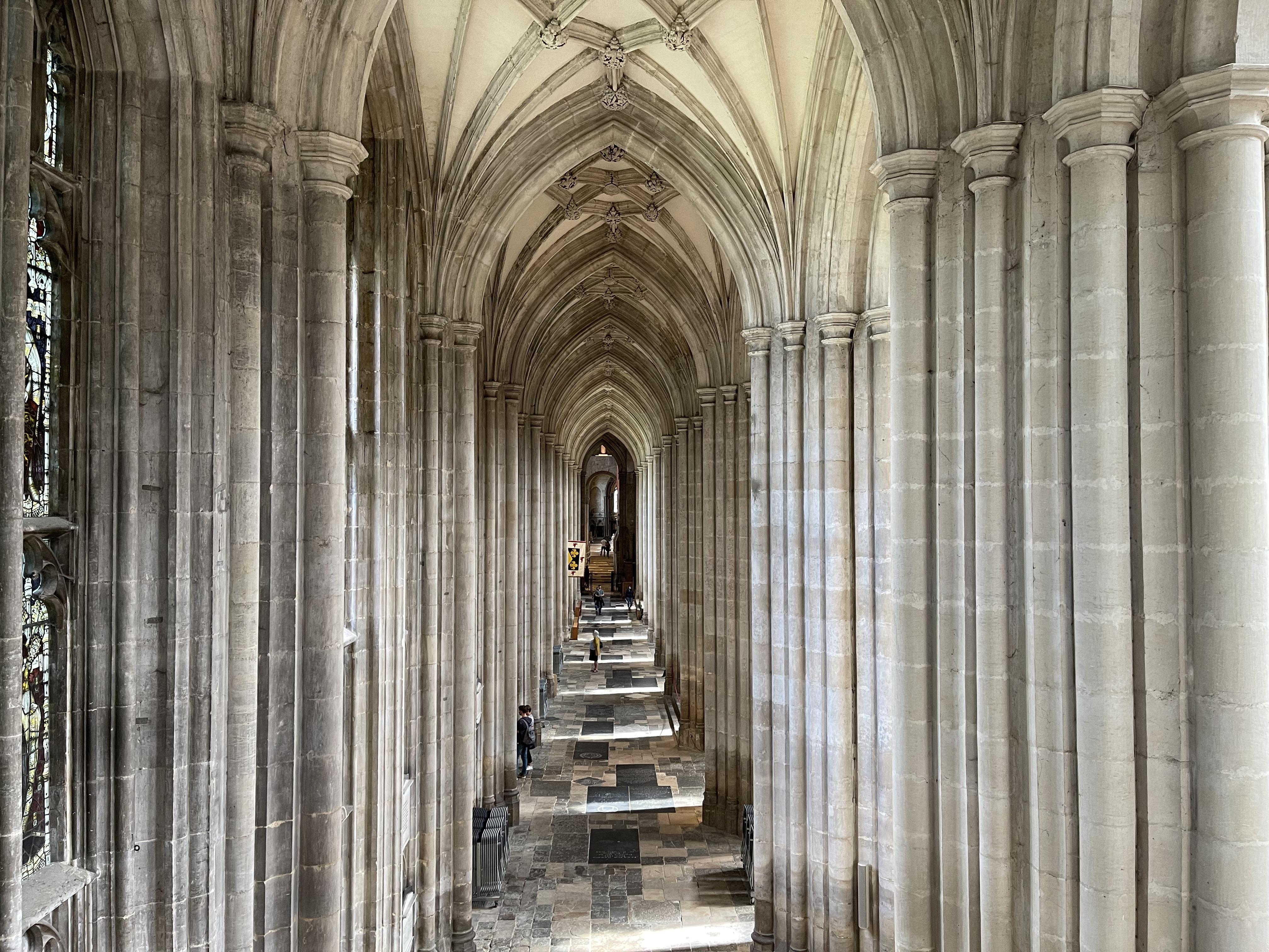 Looking down the gothic gallery of Winchester Cathedral to the Norman transept | Scrolller