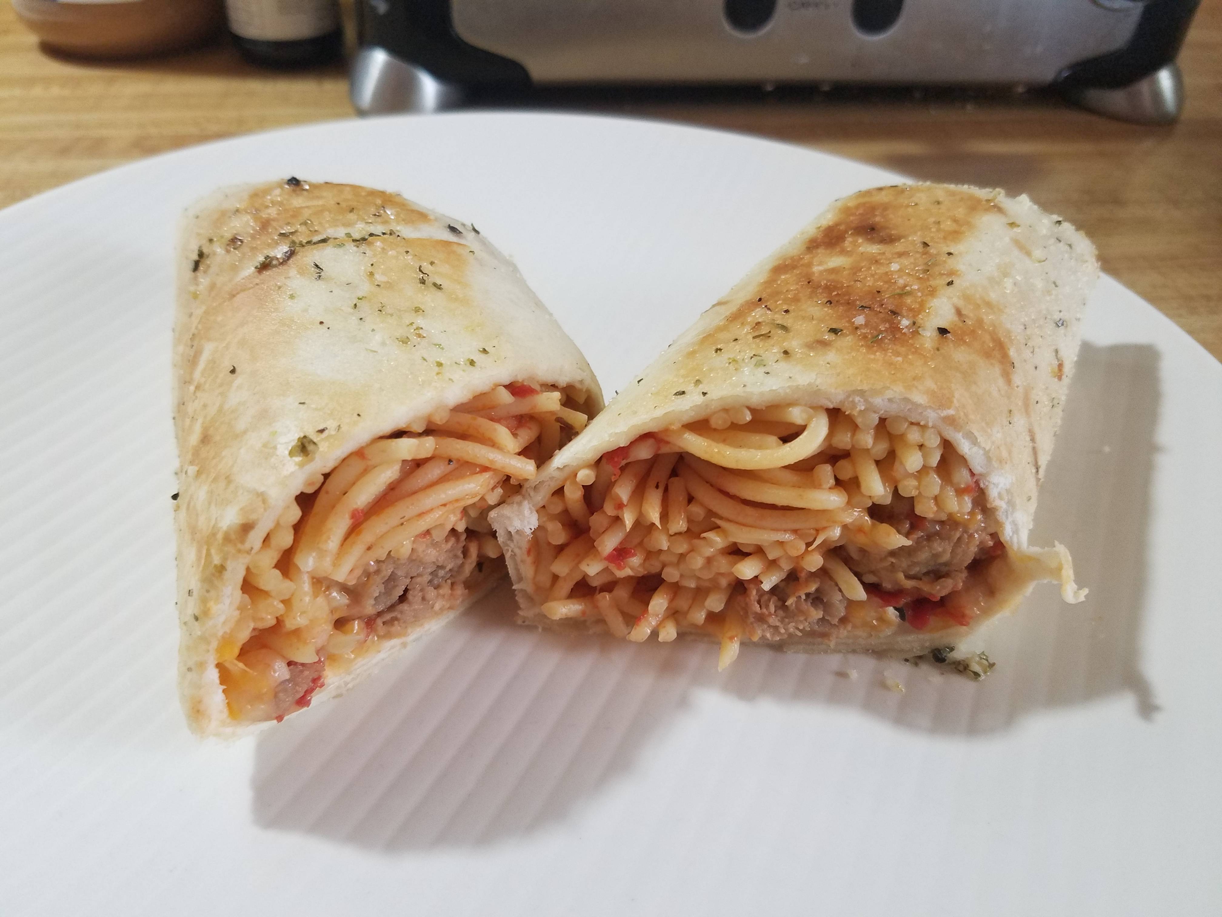 Made a spaghetti and meatballs burrito. The garlic herb buttered tortilla was awesome. | Scrolller