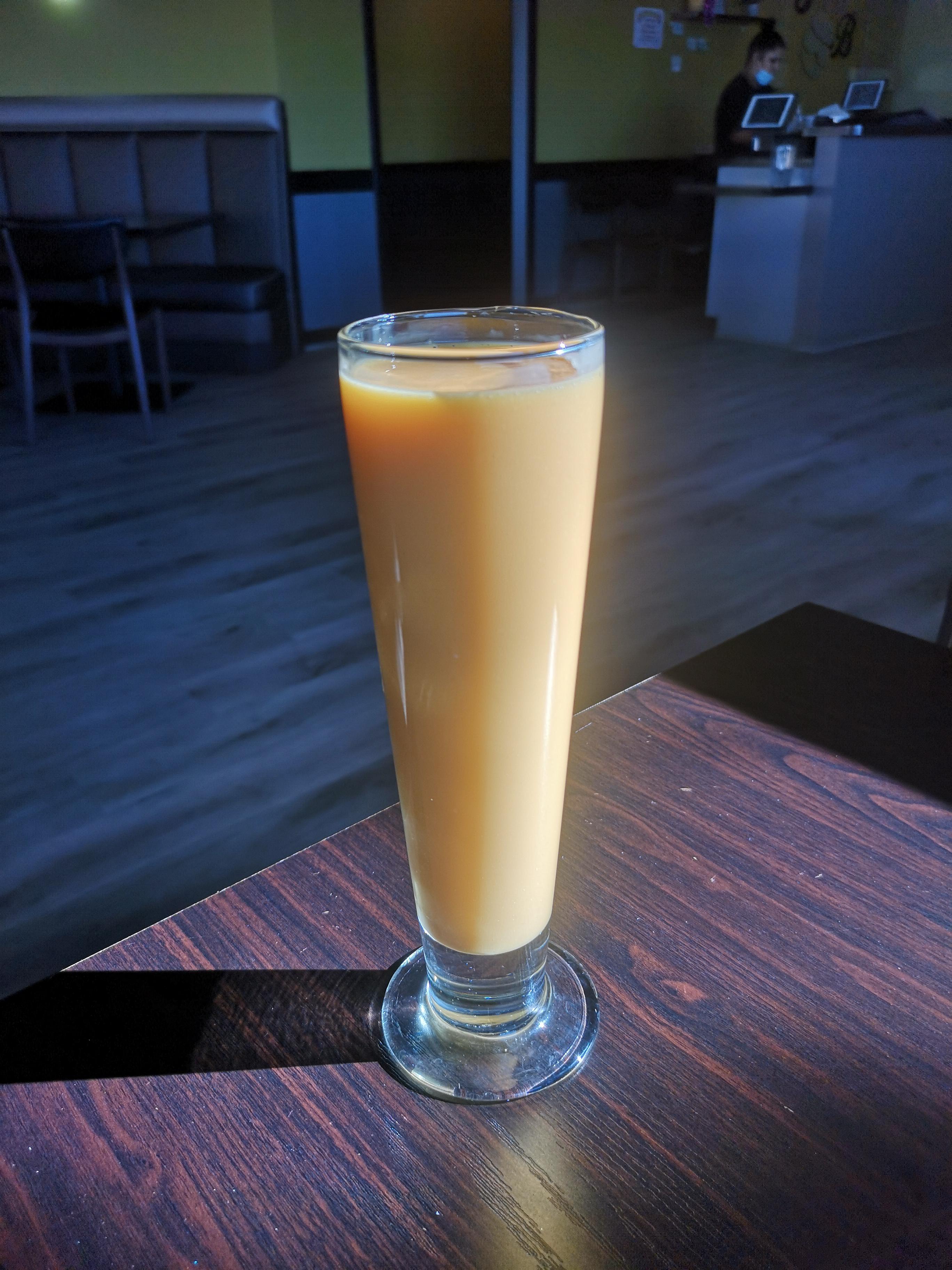 Mango Lassi under sunlight glow through a window | Scrolller