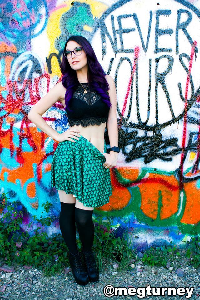 Meg Turney pulling down her skirt | Scrolller