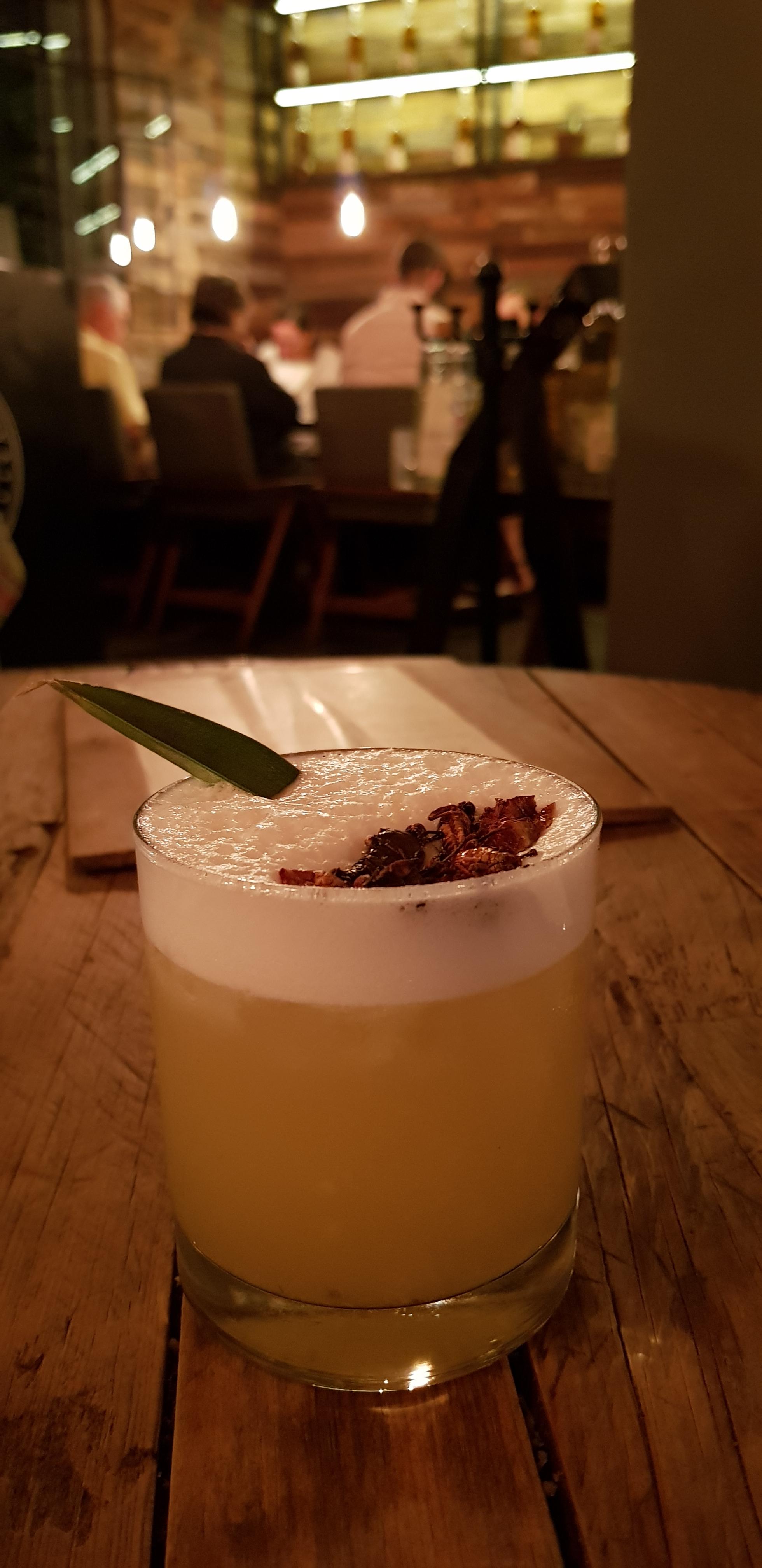 Mezcal cocktail with grasshoppers at Oaxaca | Scrolller