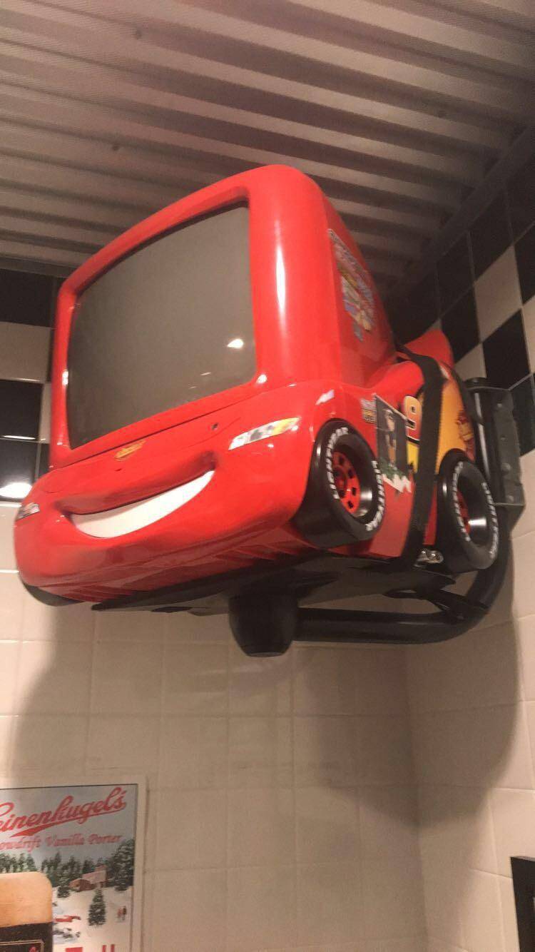 Miniature lightning McQueen television Inside a bathroom at Quaker steak and lube | Scrolller