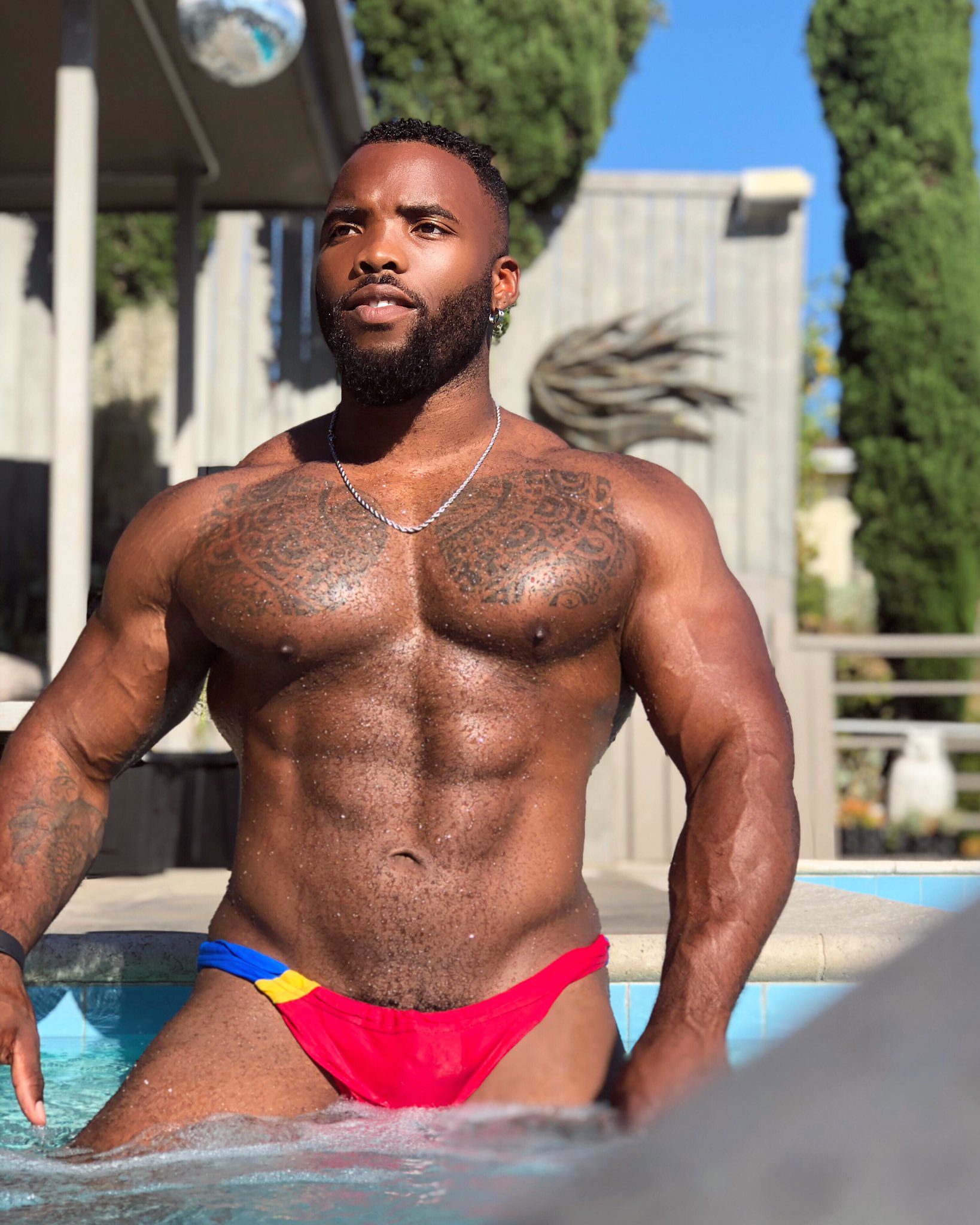 Muscle man at the pool. | Scrolller