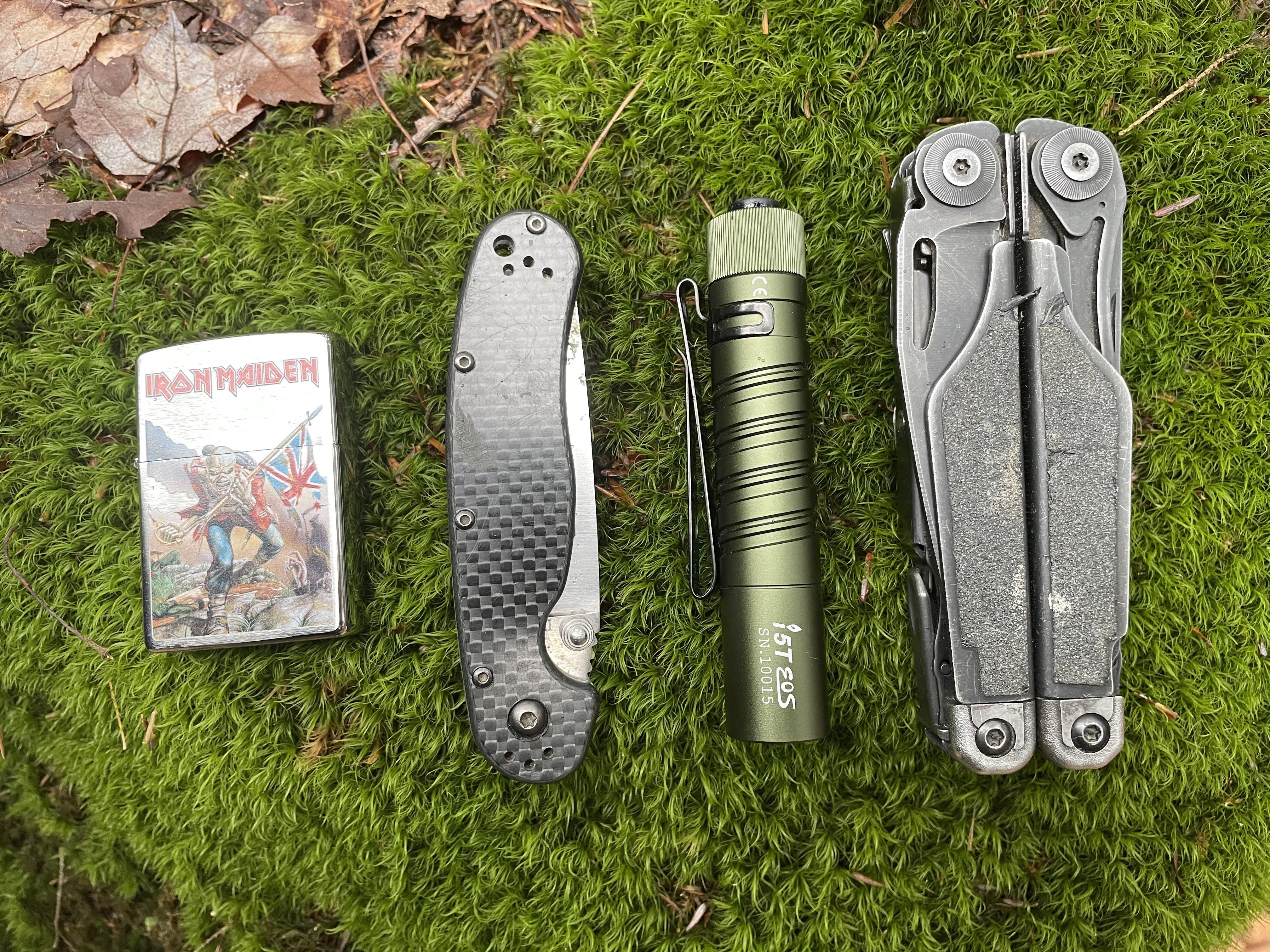 My current EDC, left to right my zippo, rat 2, olight I5T EOS, and ...