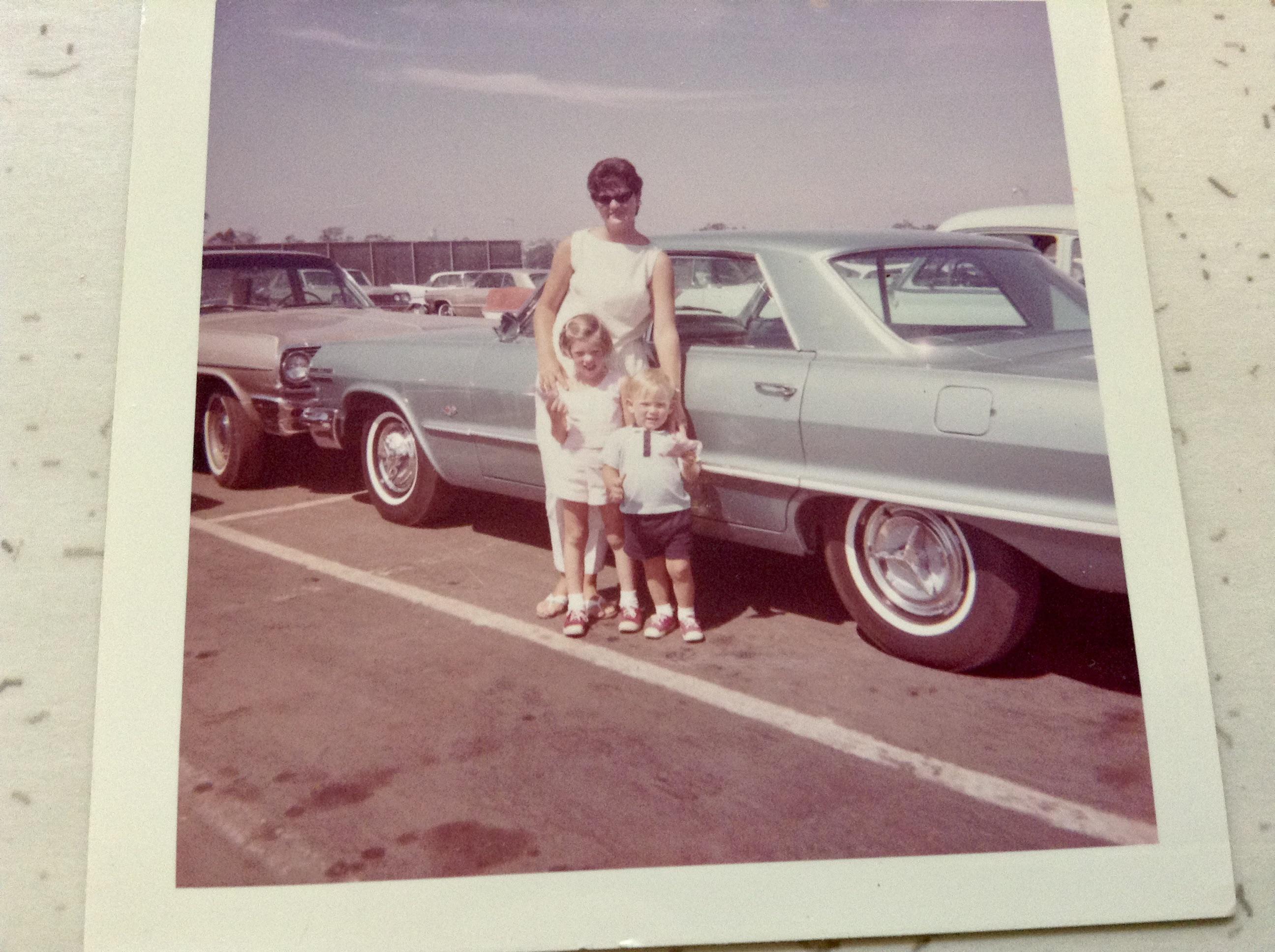 My Gma, aunt, and dad with their new 1963 Chevy Impala outside the LA Zoo | Scrolller
