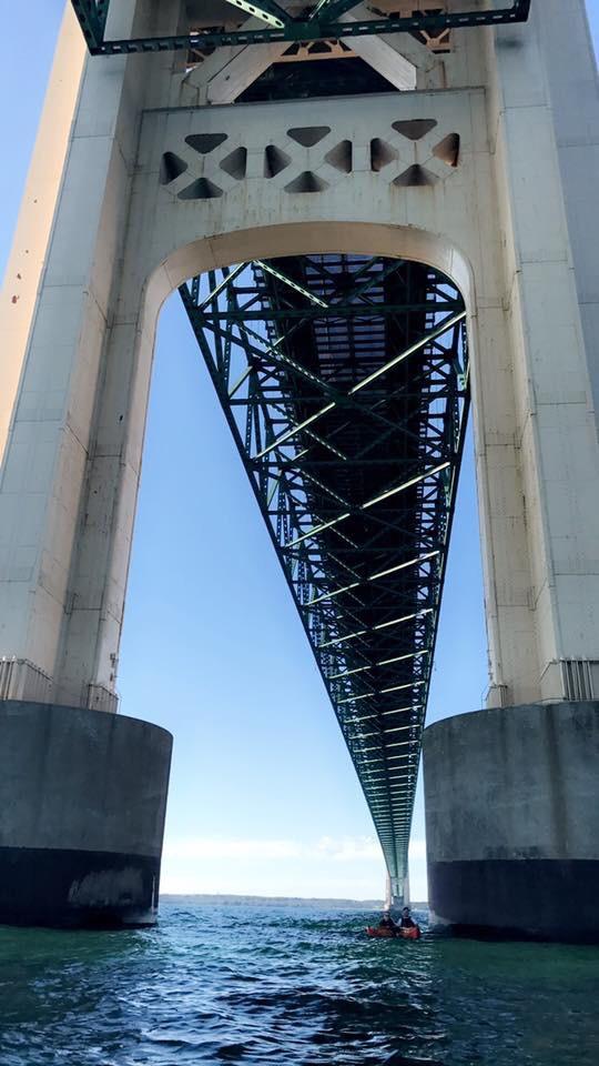 My husband and I kayaking under the Mackinac Bridge. | Scrolller