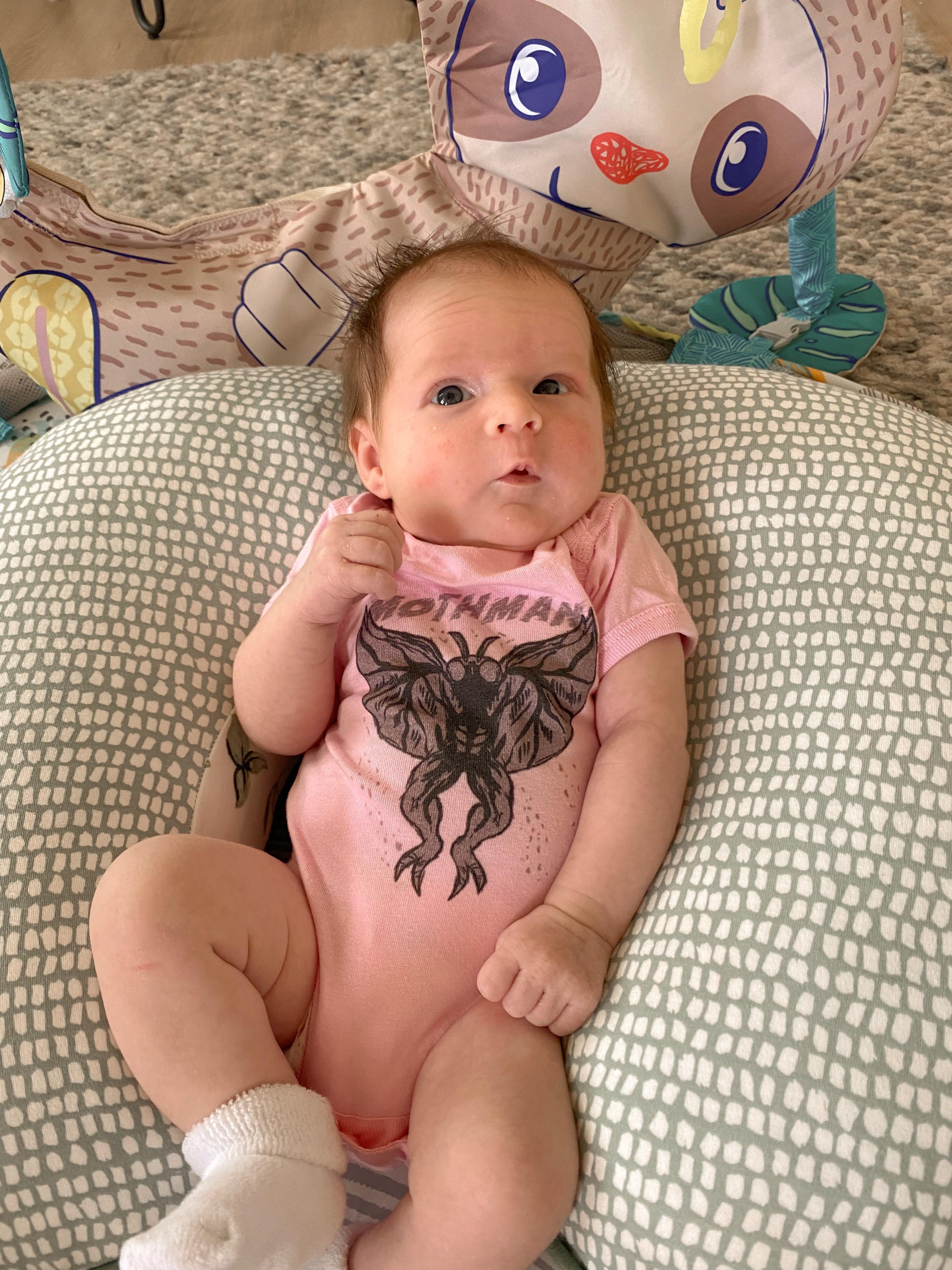 My parents had Mothman clothes made for our newborn. | Scrolller