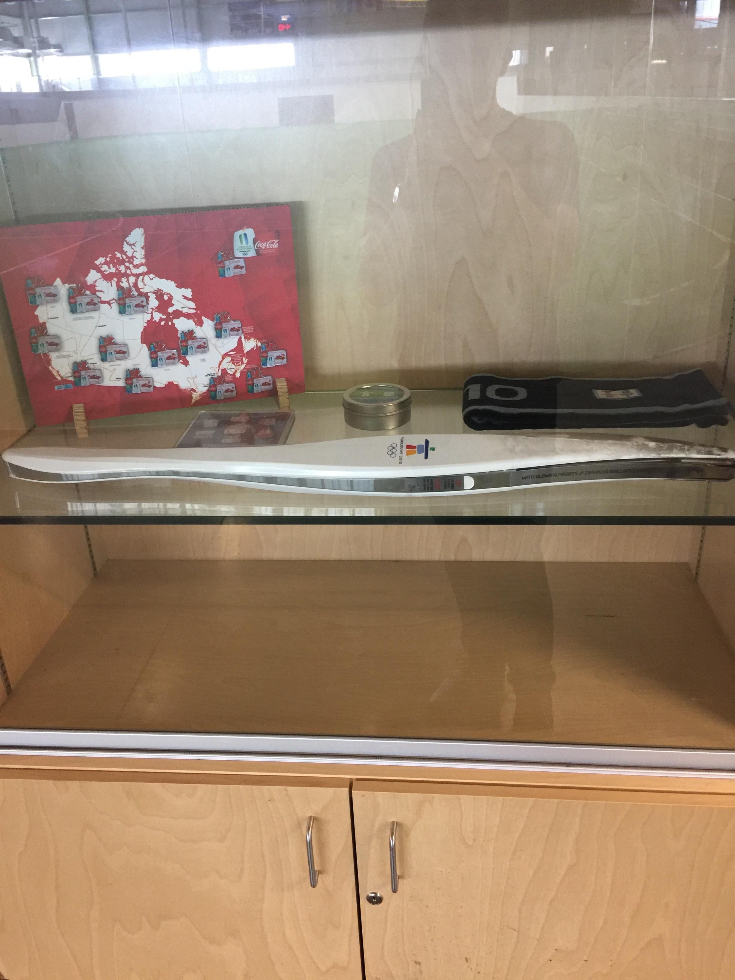 My workplace keeps a torch from the Vancouver Olympics in our display case. | Scrolller